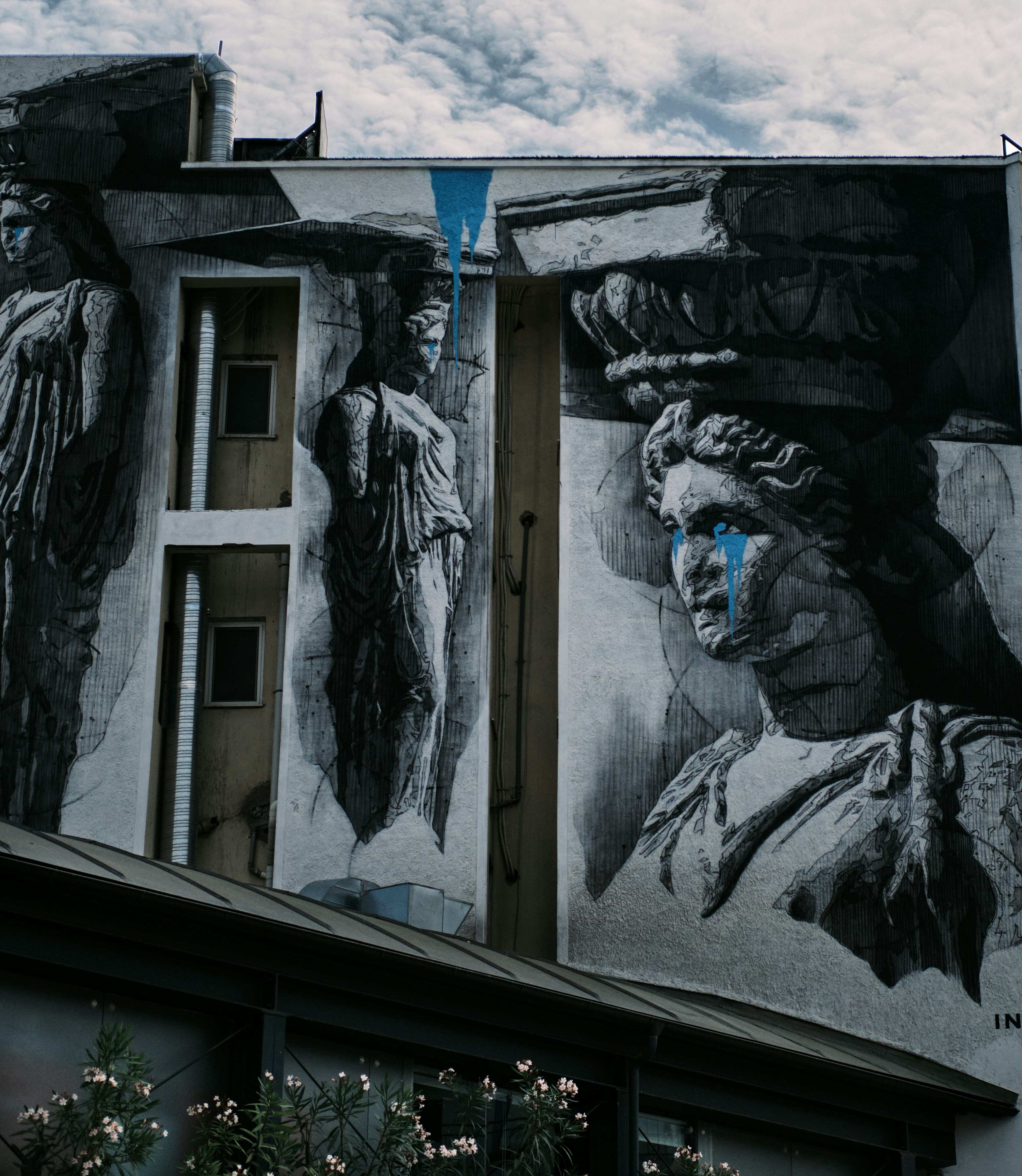 Blue Tears on a Concrete Pantheon: A Graffiti Mural of Classical Muses