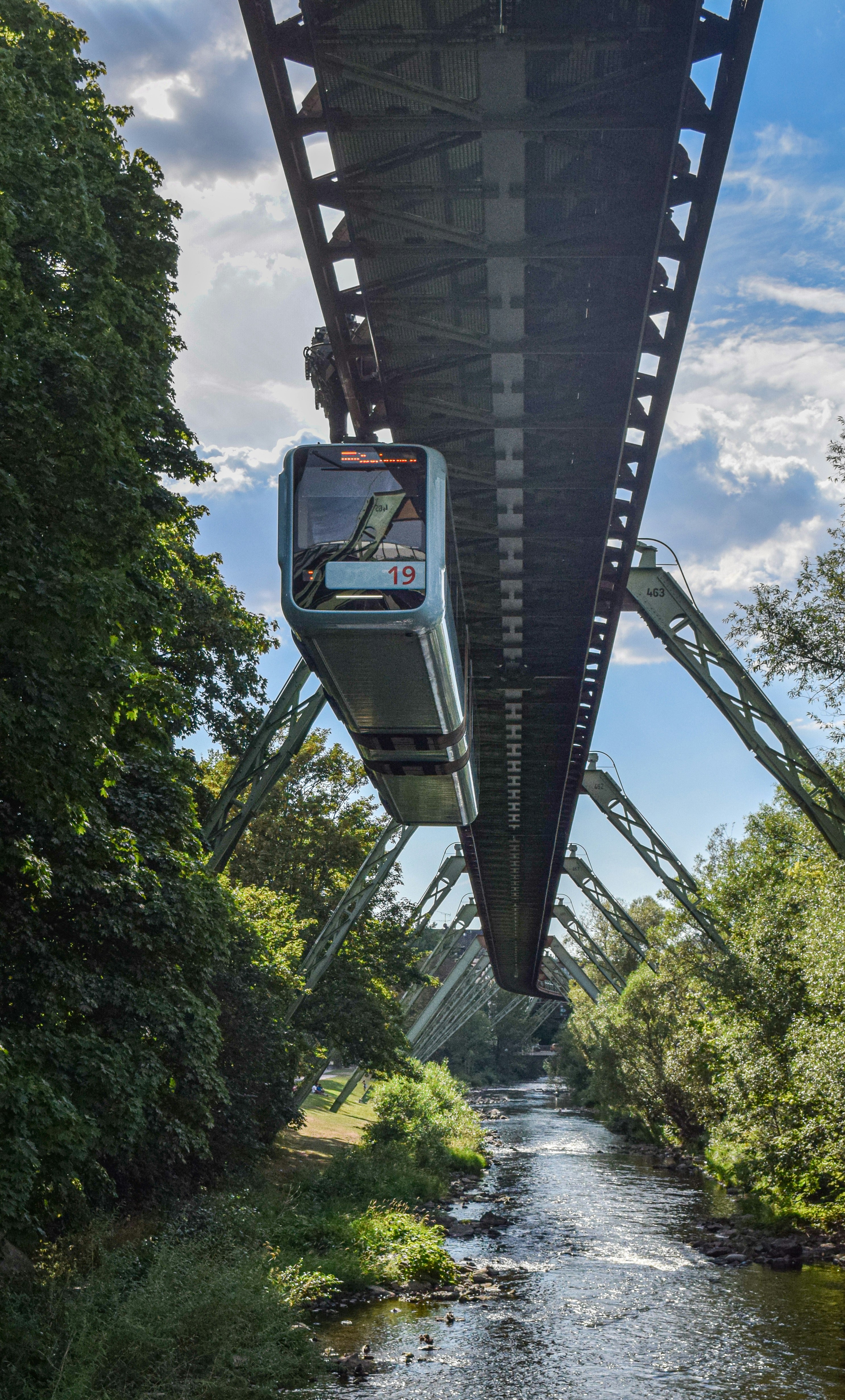 A train going over a bridge over a river