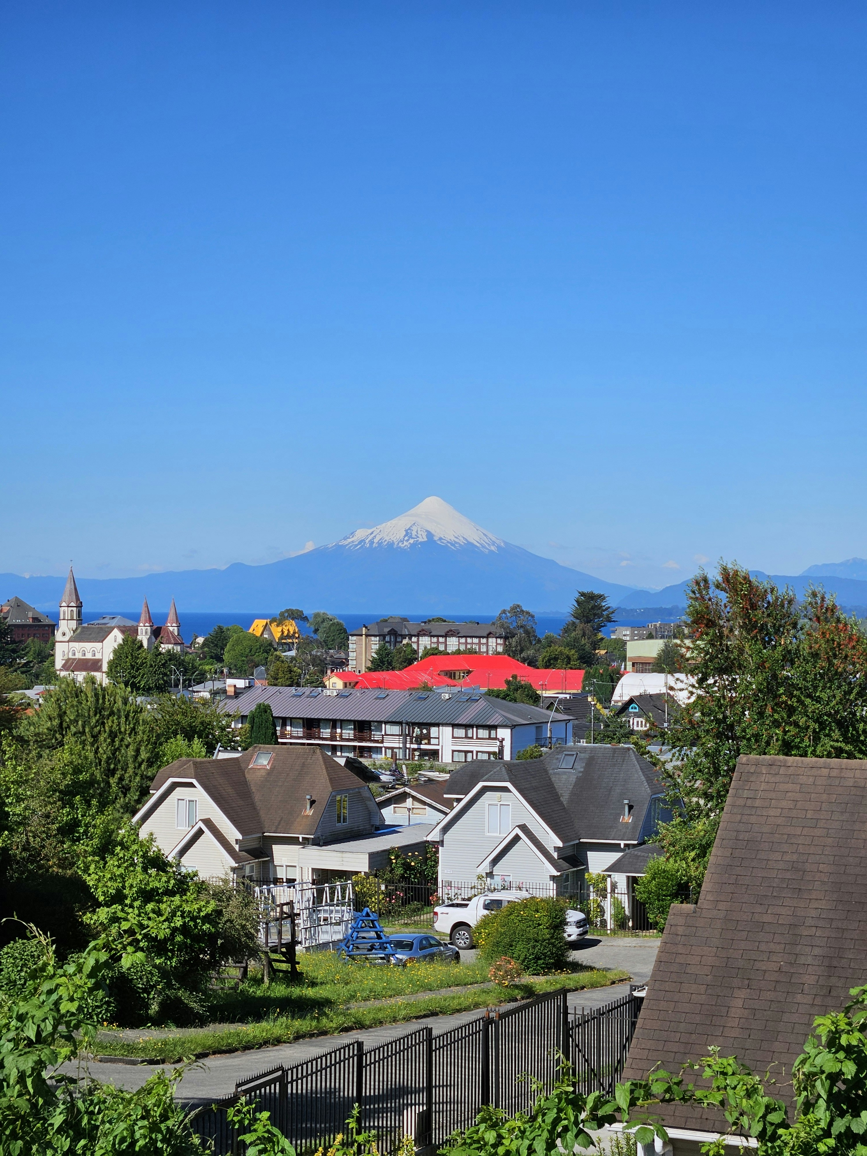 A view of a town with a mountain in the background