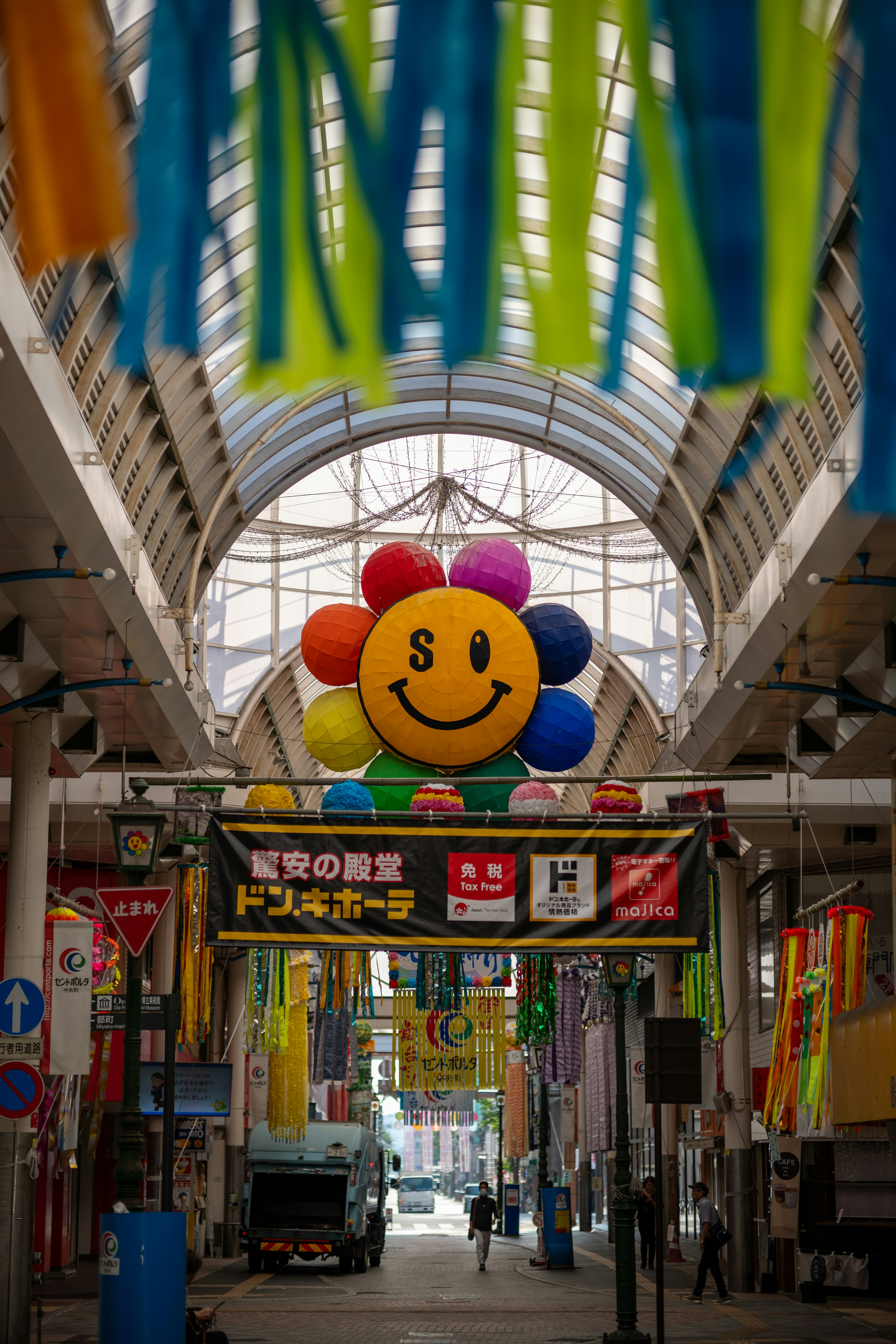 A shopping mall with a smiley face hanging from the ceiling photo ...