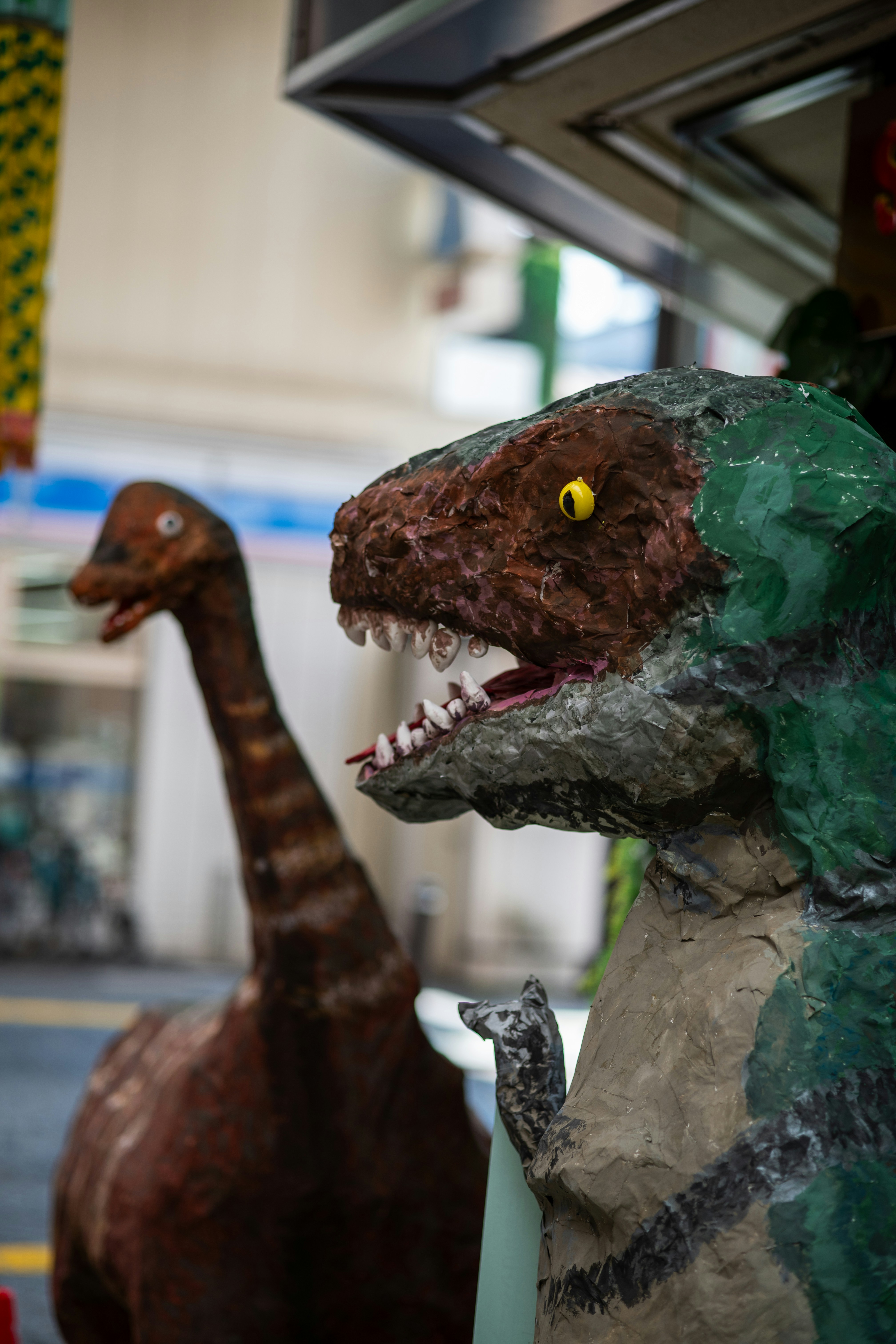 A close up of a fake dinosaur and a fake dinosaur