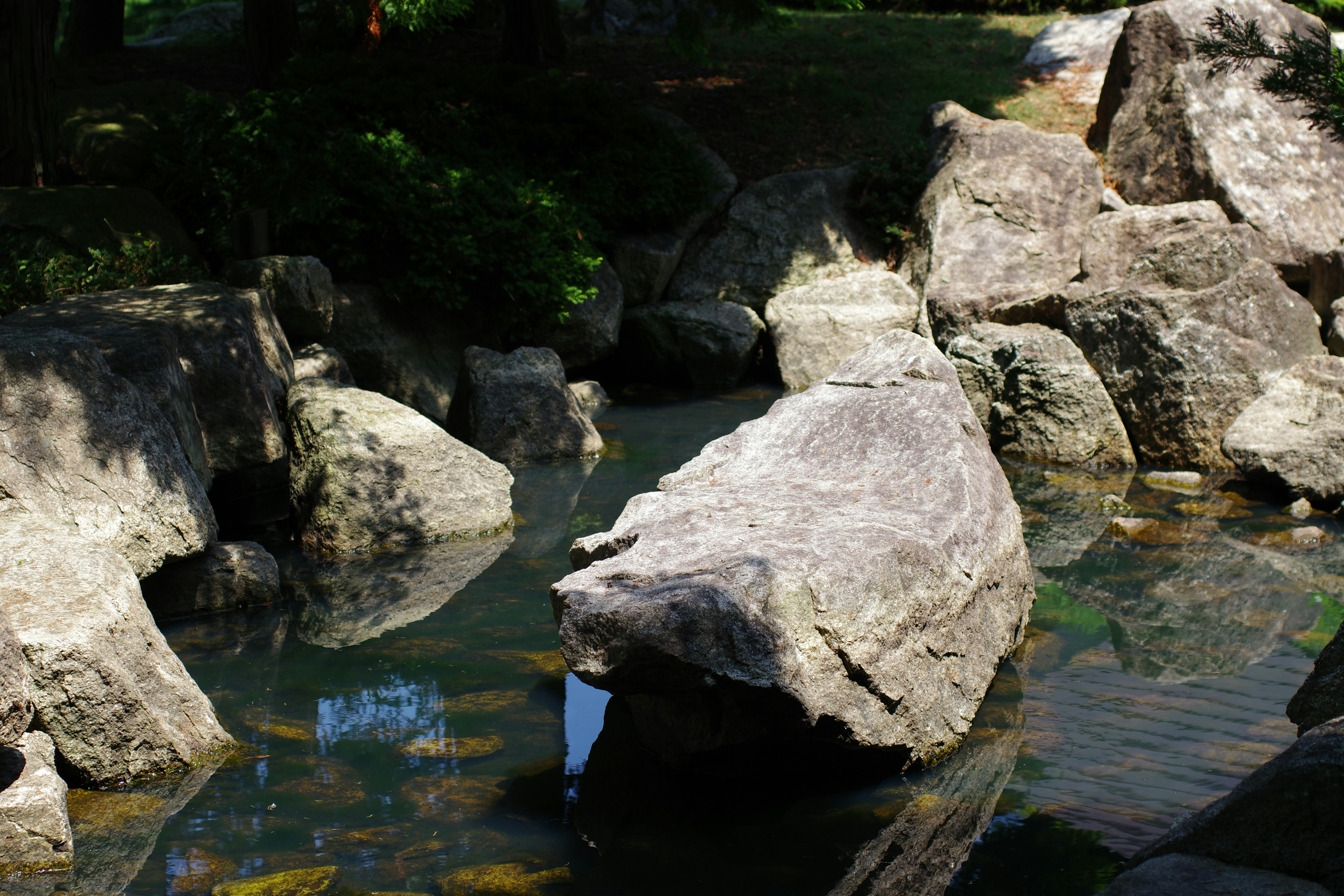 A stream of water surrounded by large rocks photo – Free 食物 Image on ...