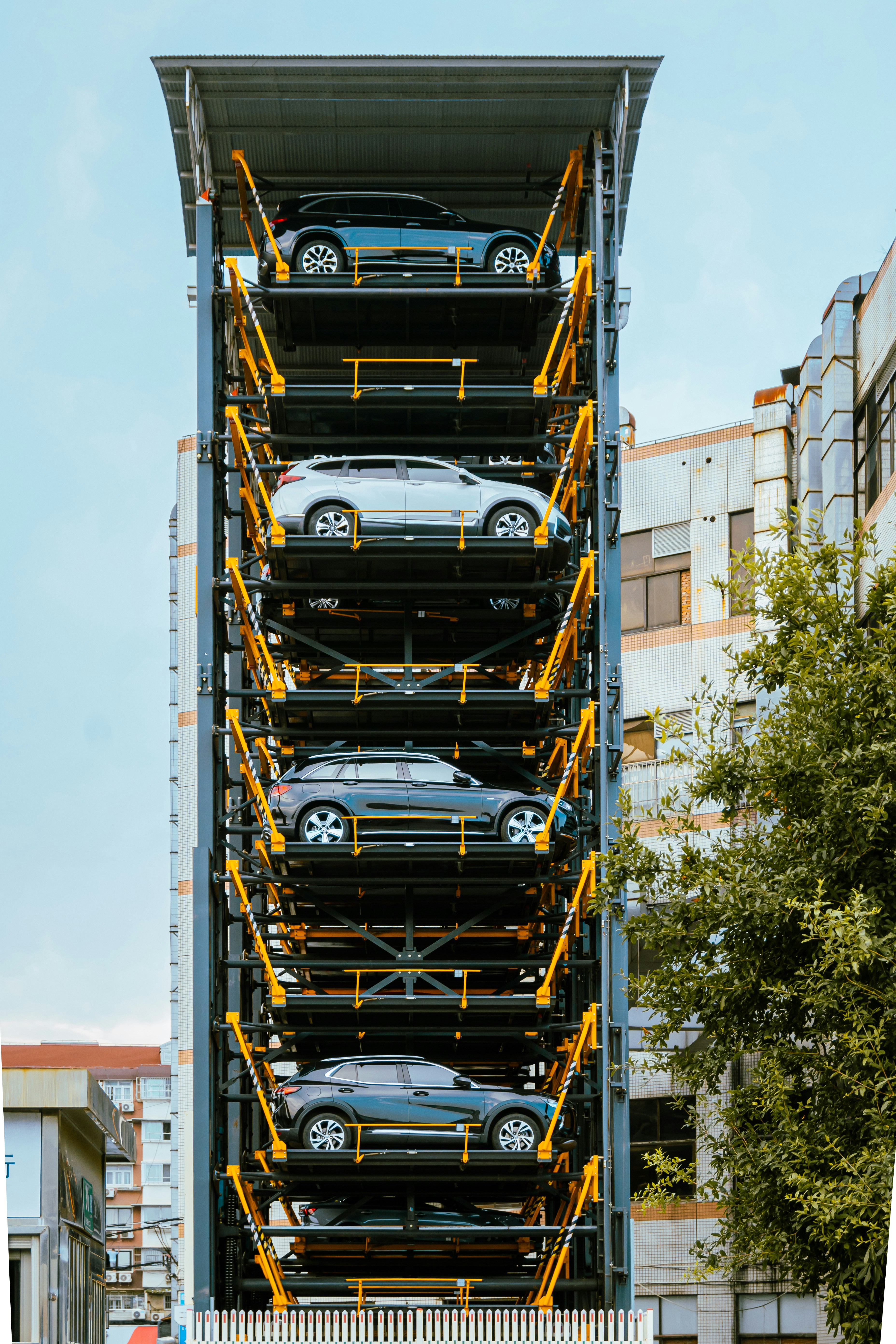 Five-Deck Auto Elevator: Cars Ascend in a Steel Skyline