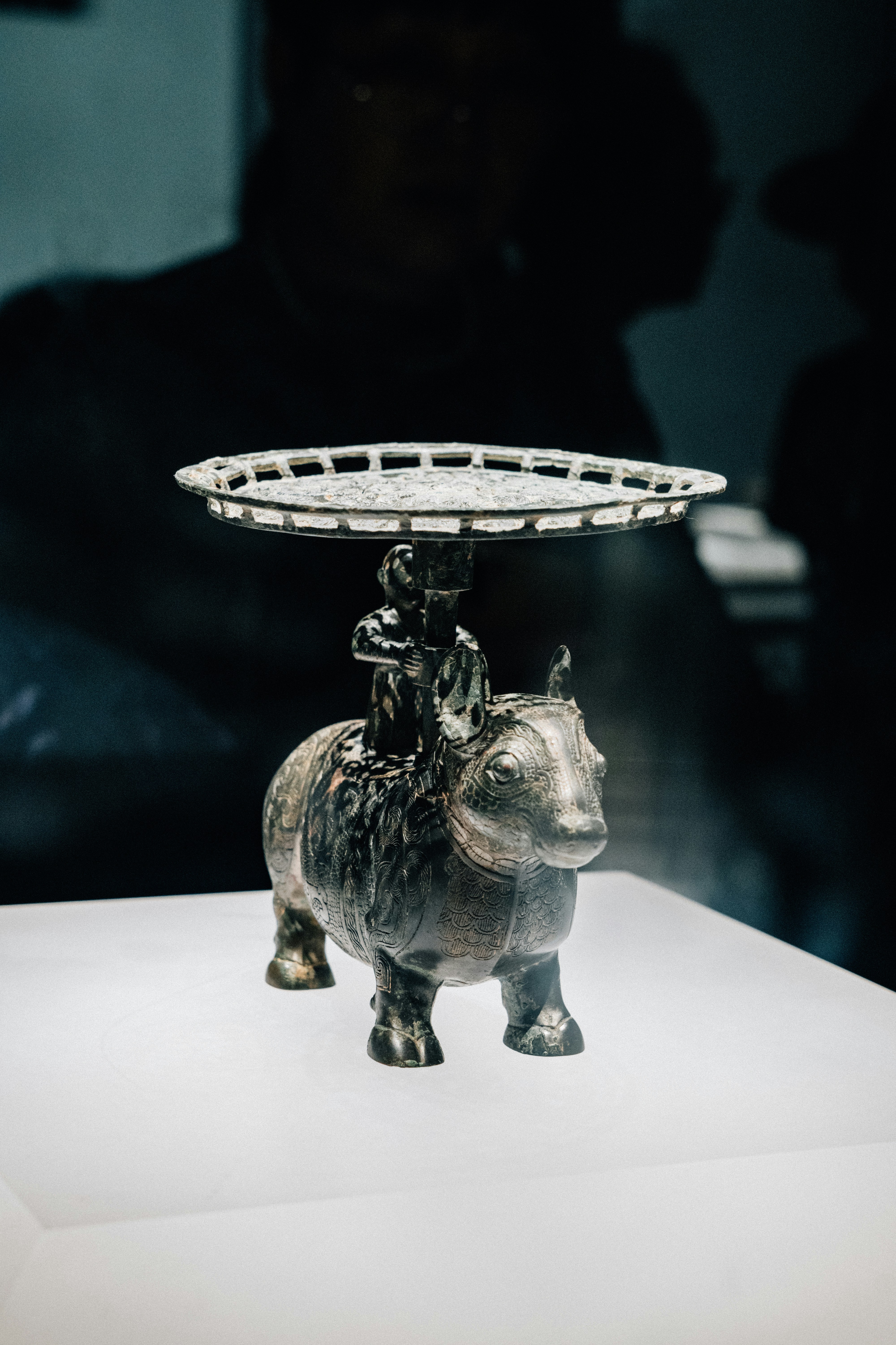 Haloed Elephant on a Pedestal: A Tiny Metal Sculpture