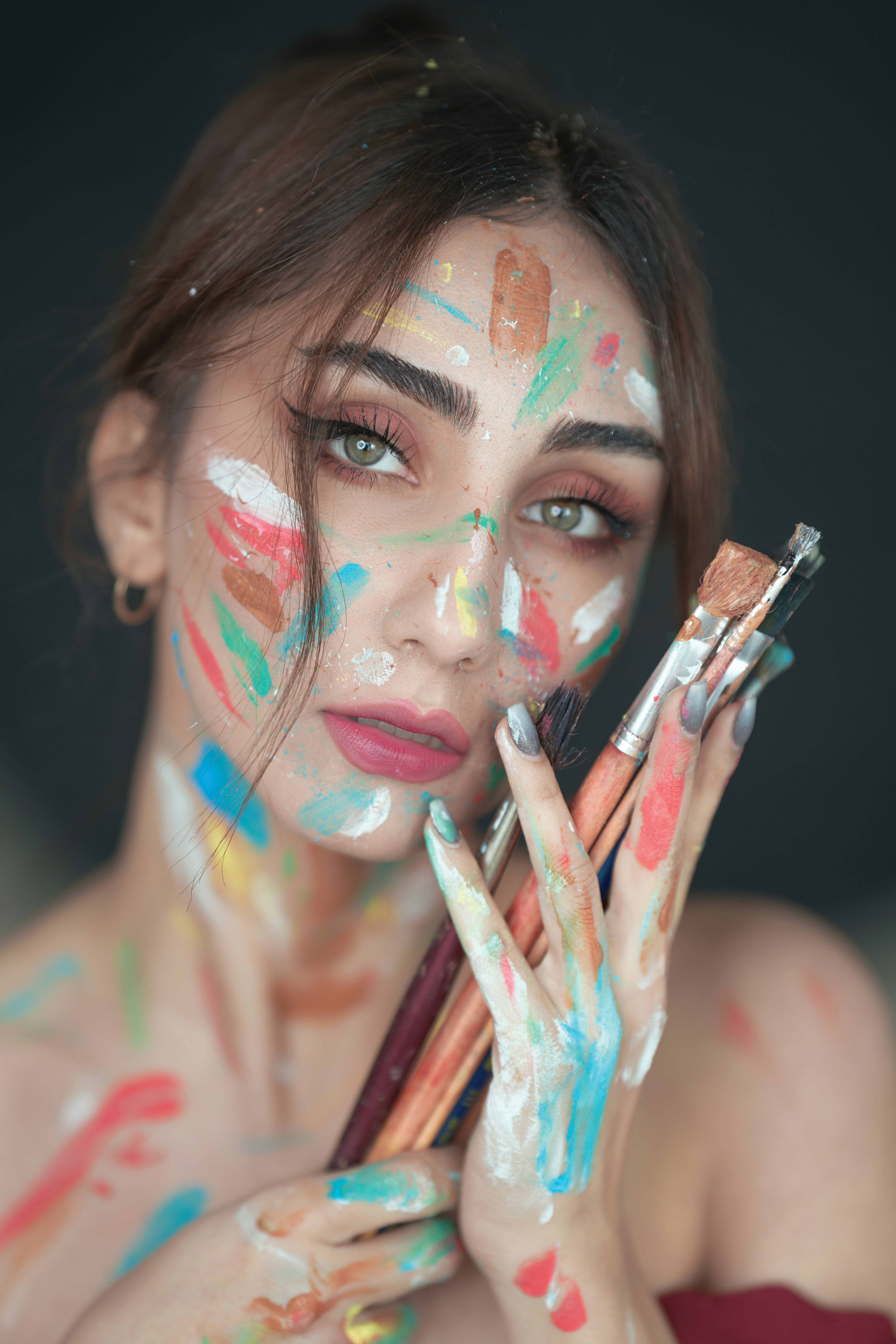 Palette Portrait: Green-Eyed Gaze Amid Brushstrokes