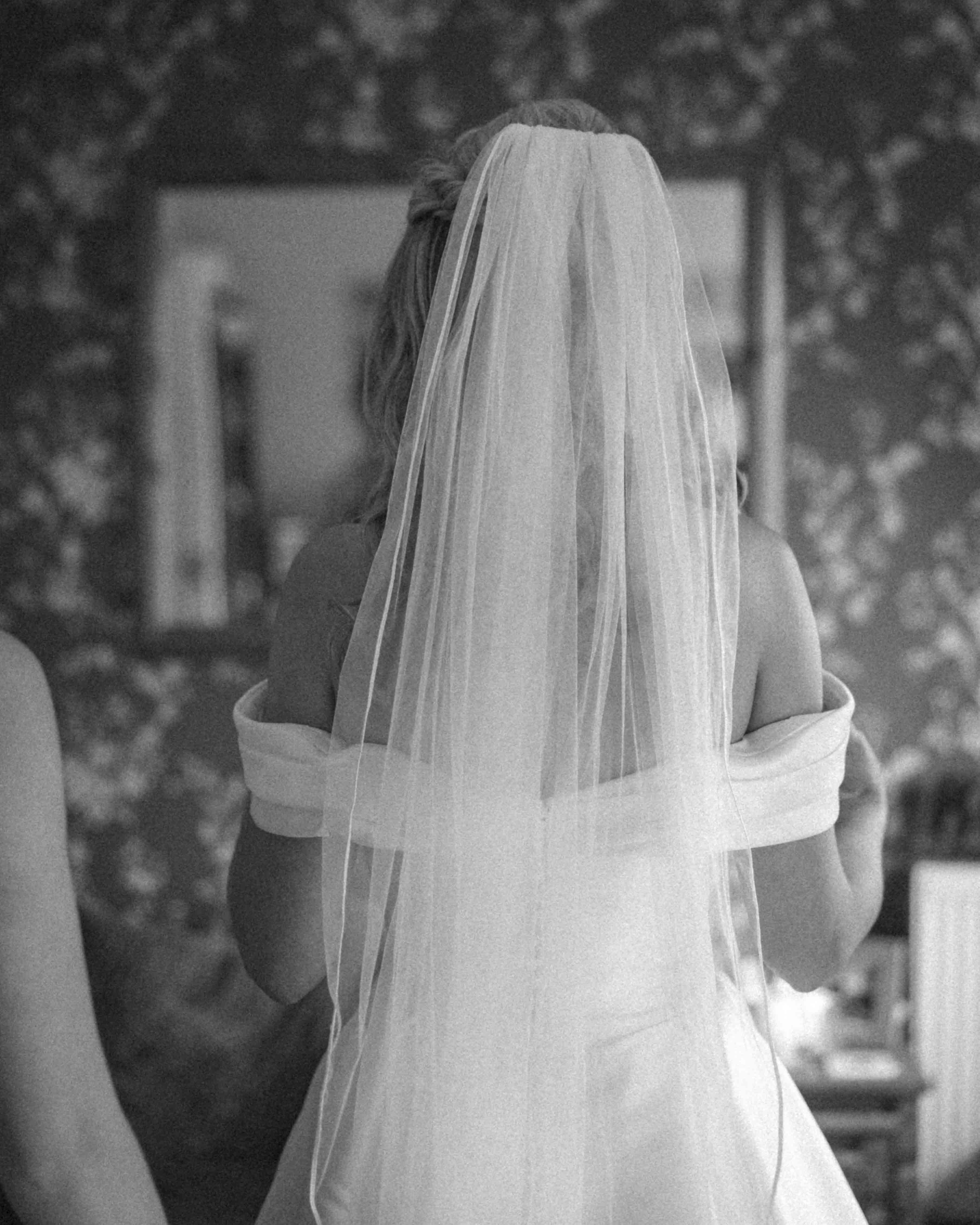 A woman standing in front of a mirror wearing a veil photo – Free ...