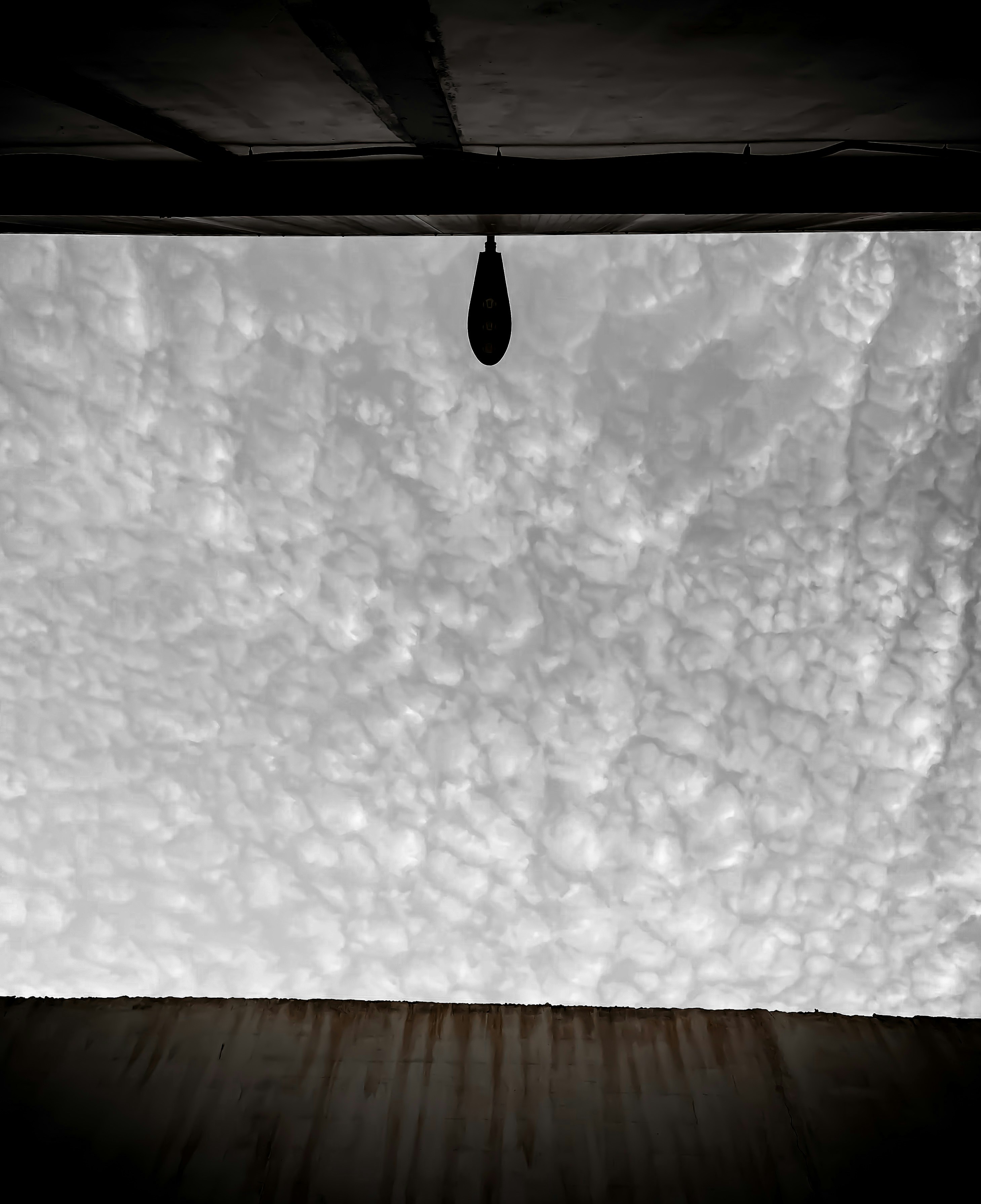 Teardrop Pendant Over a Sea of Clouds