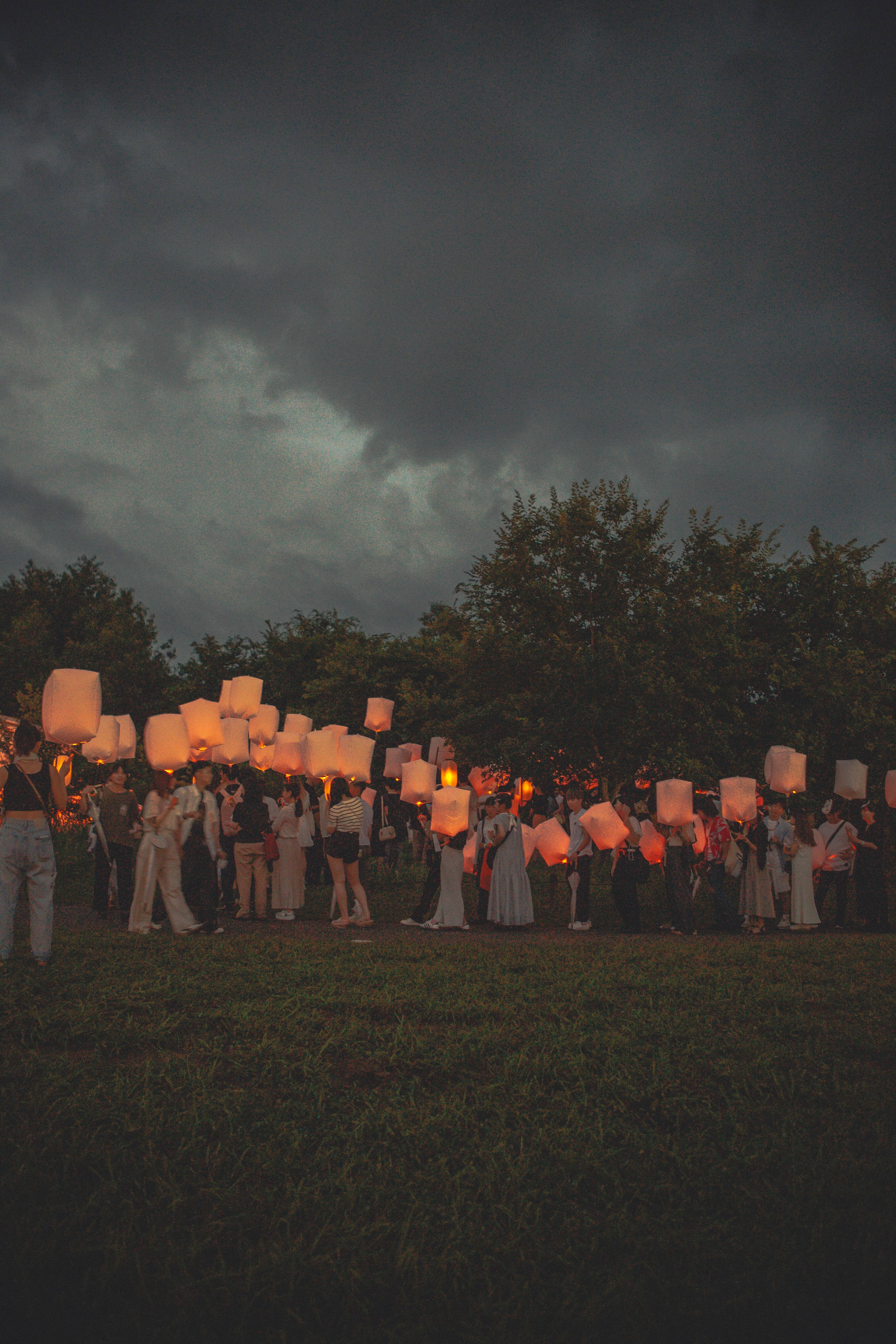 Lantern Parade Under a Stormy Sky