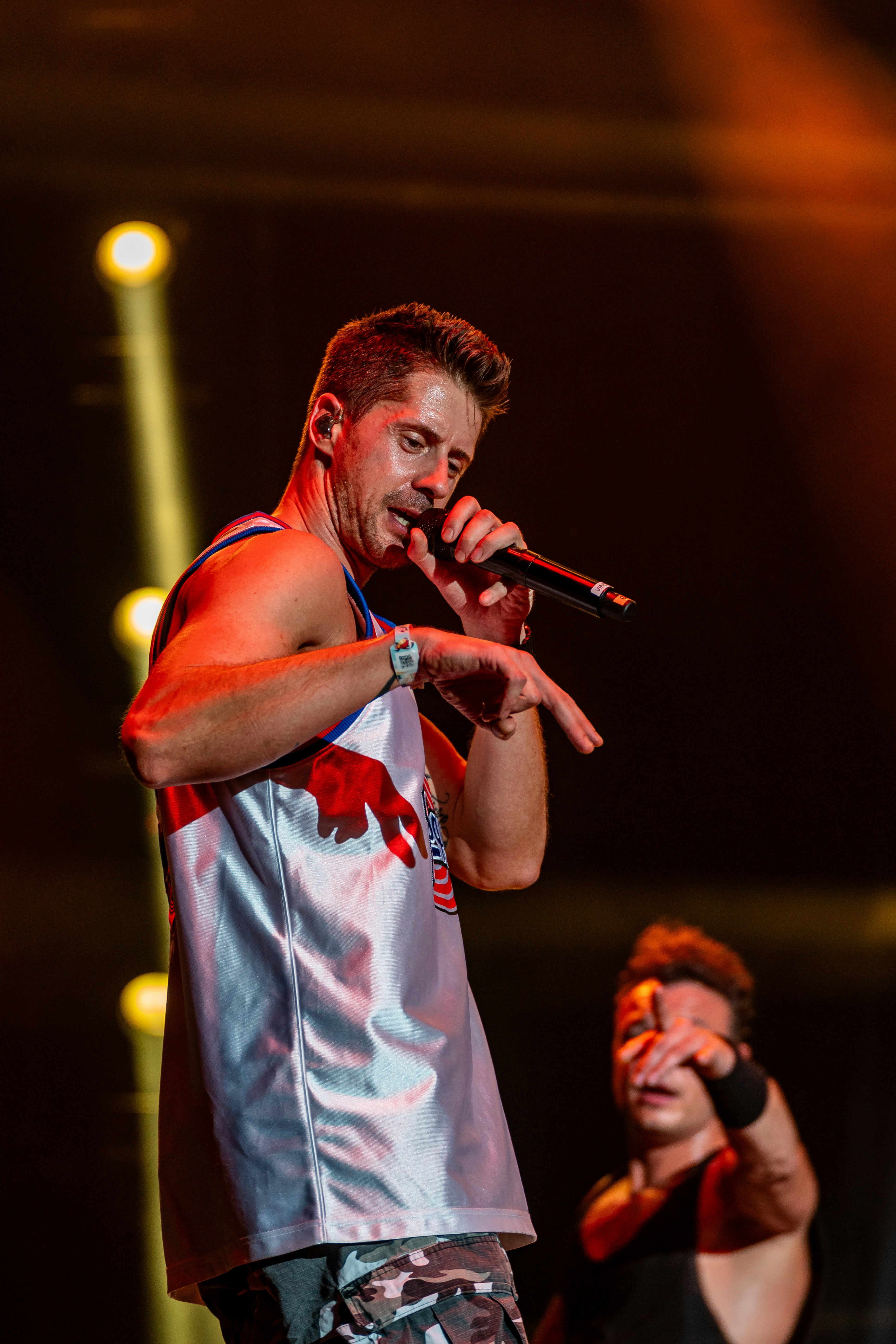 Two men on stage with one holding a microphone photo – Free Leipzig ...