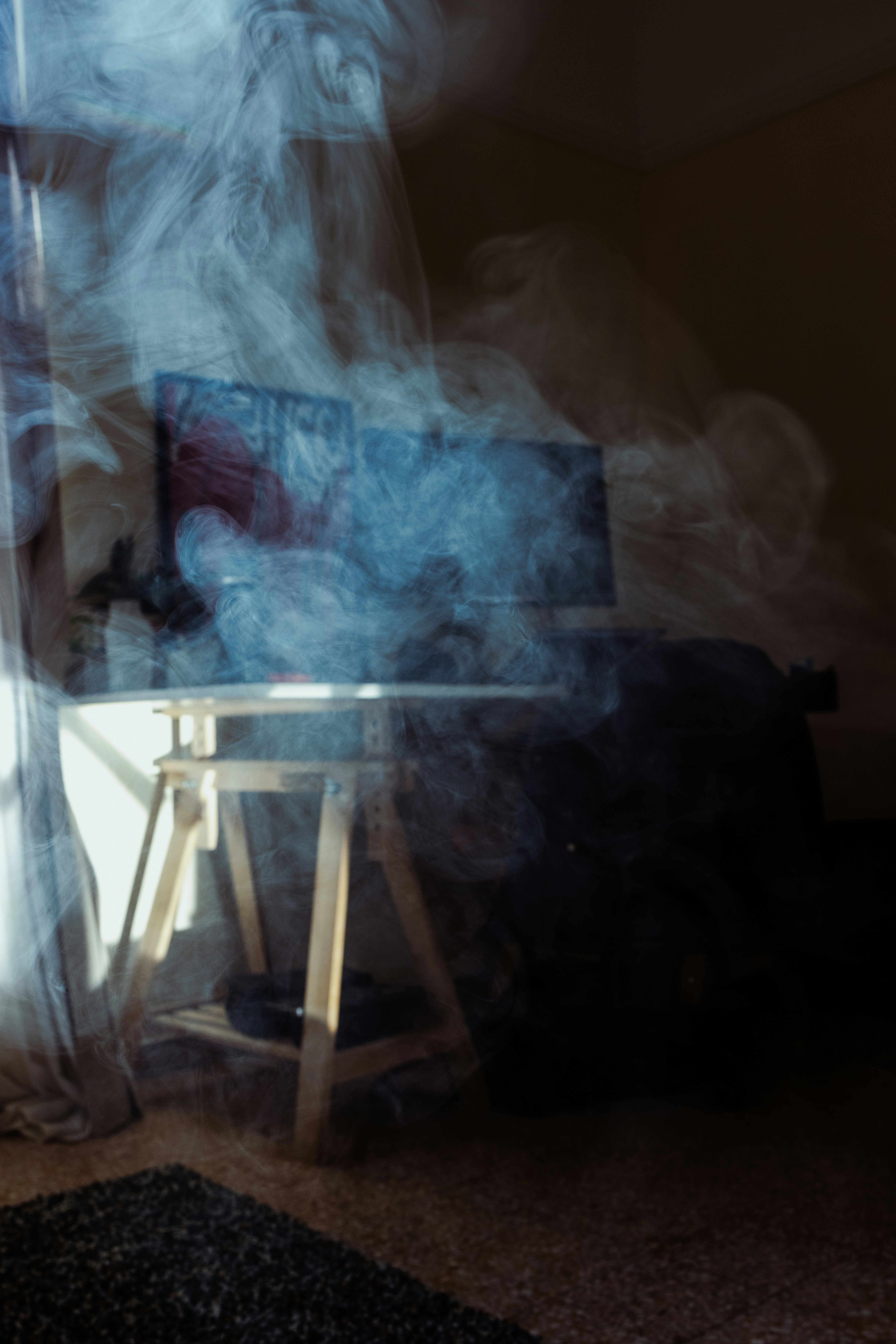 Easel in a Veil: Smoke Weaves Through a Minimal Studio