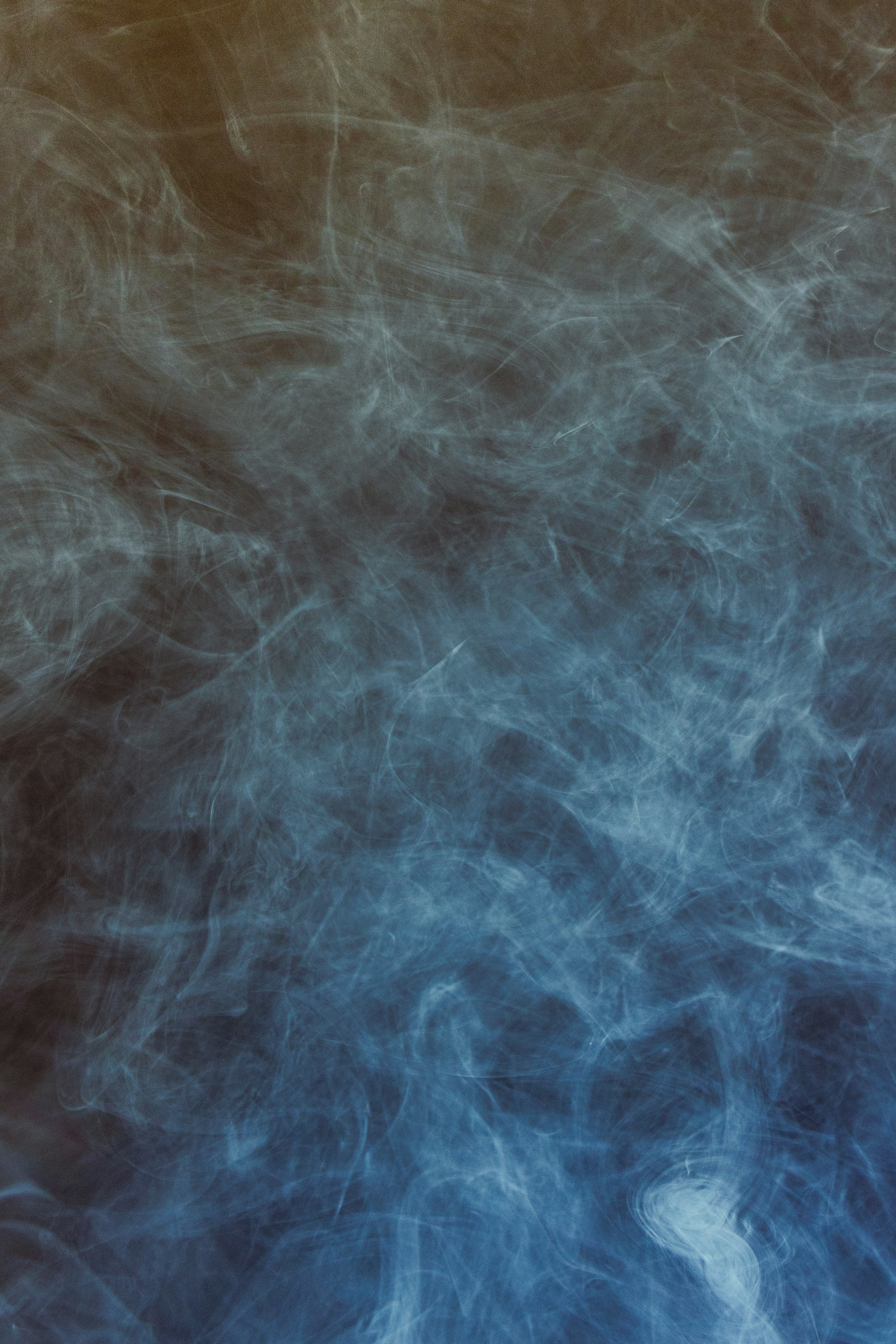 Blue Smoke Tangle Over a Warm-to-Cool Gradient