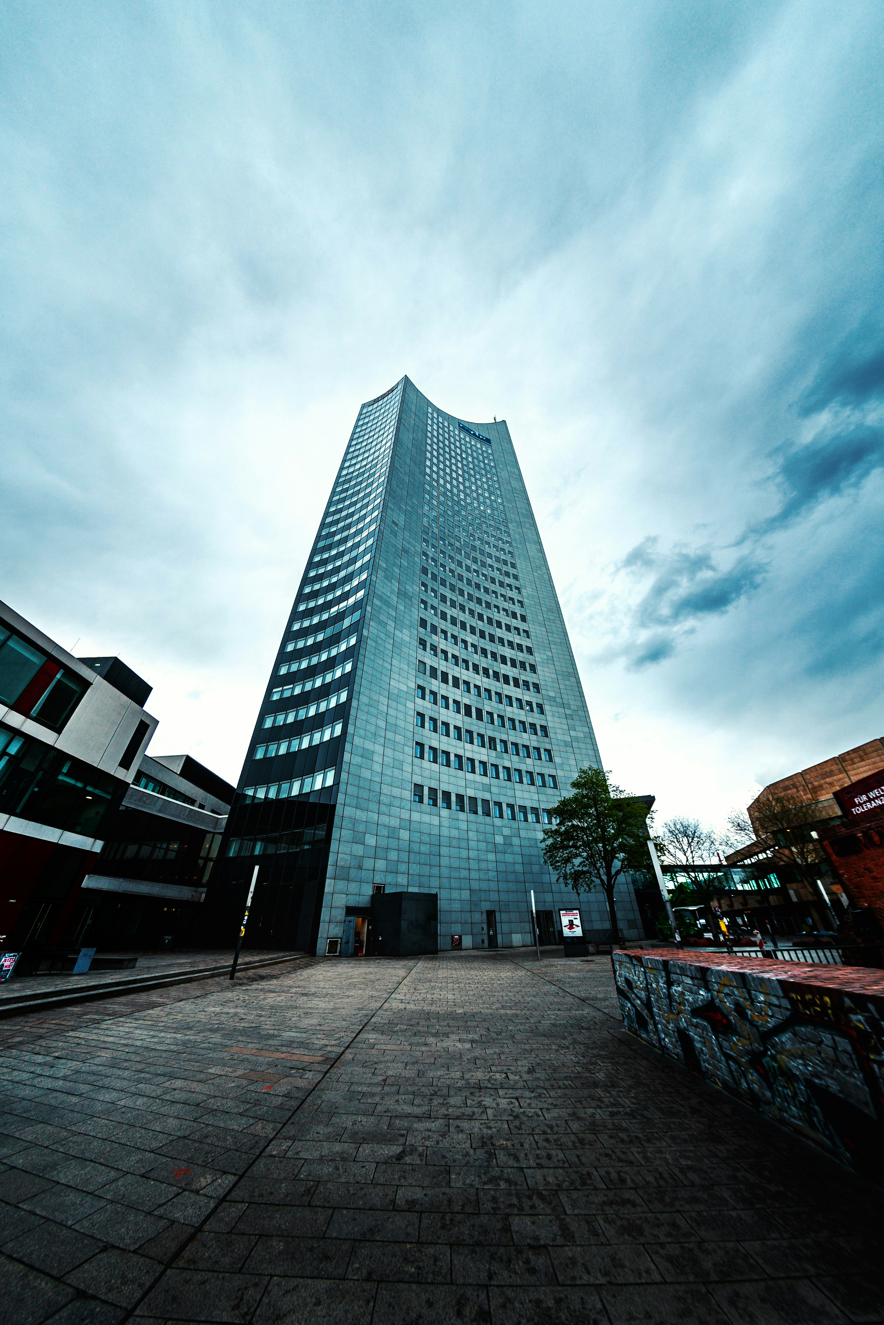 Skyward Monolith: A Low-Angle Portrait of an Urban Glass Tower
