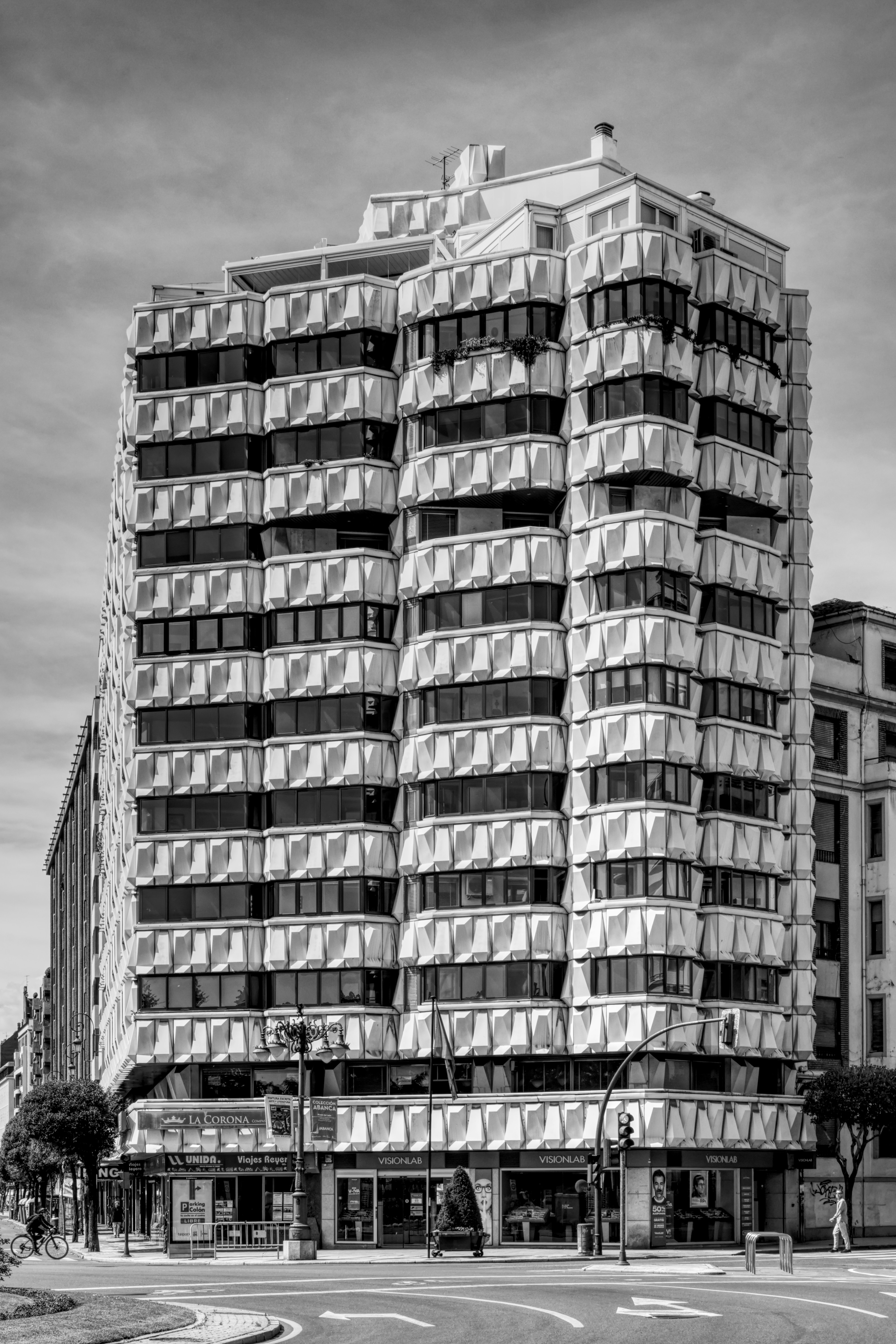 A very tall building sitting on the side of a road