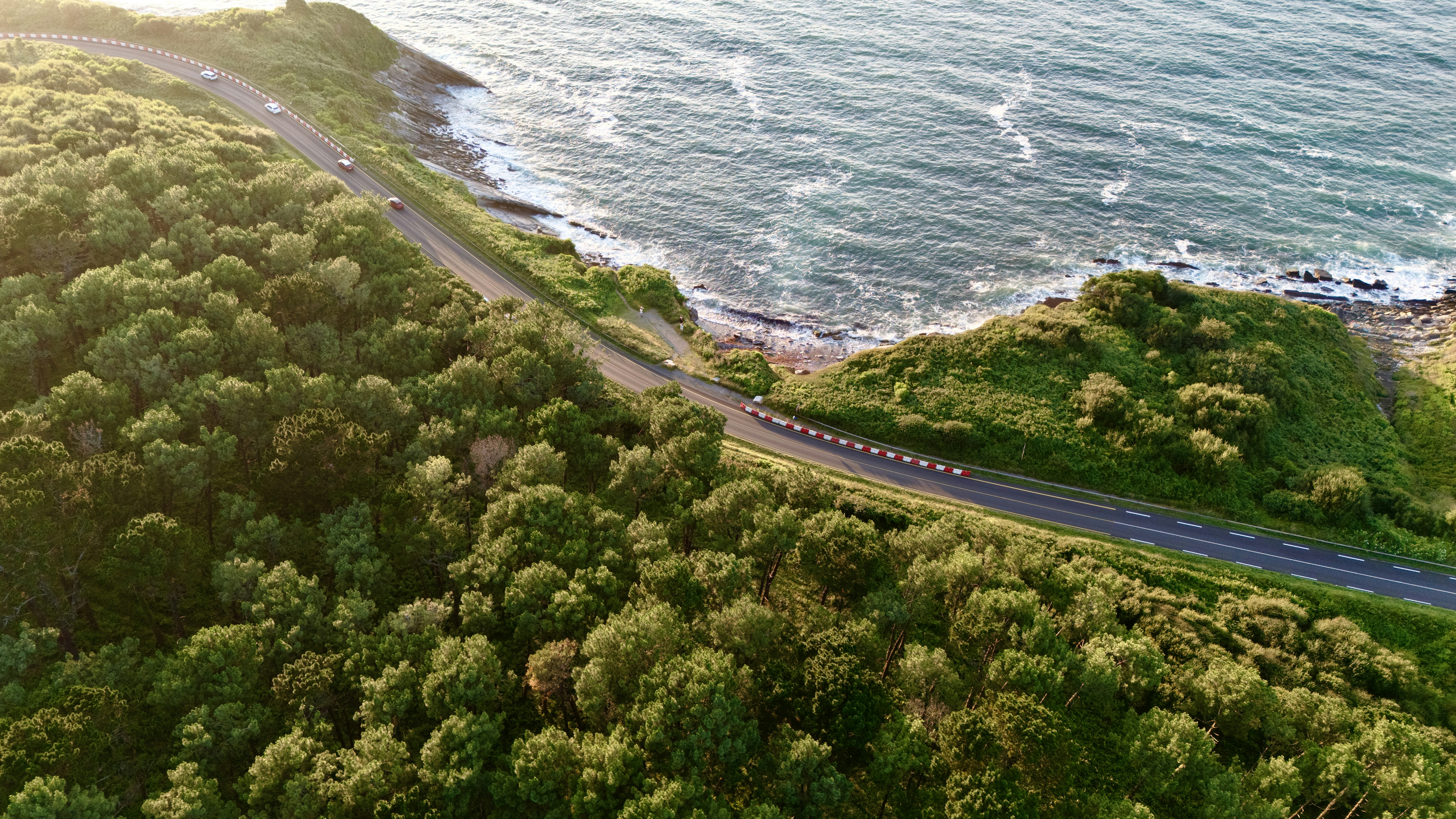 An aerial view of a winding road next to the ocean photo – Free Socoa ...