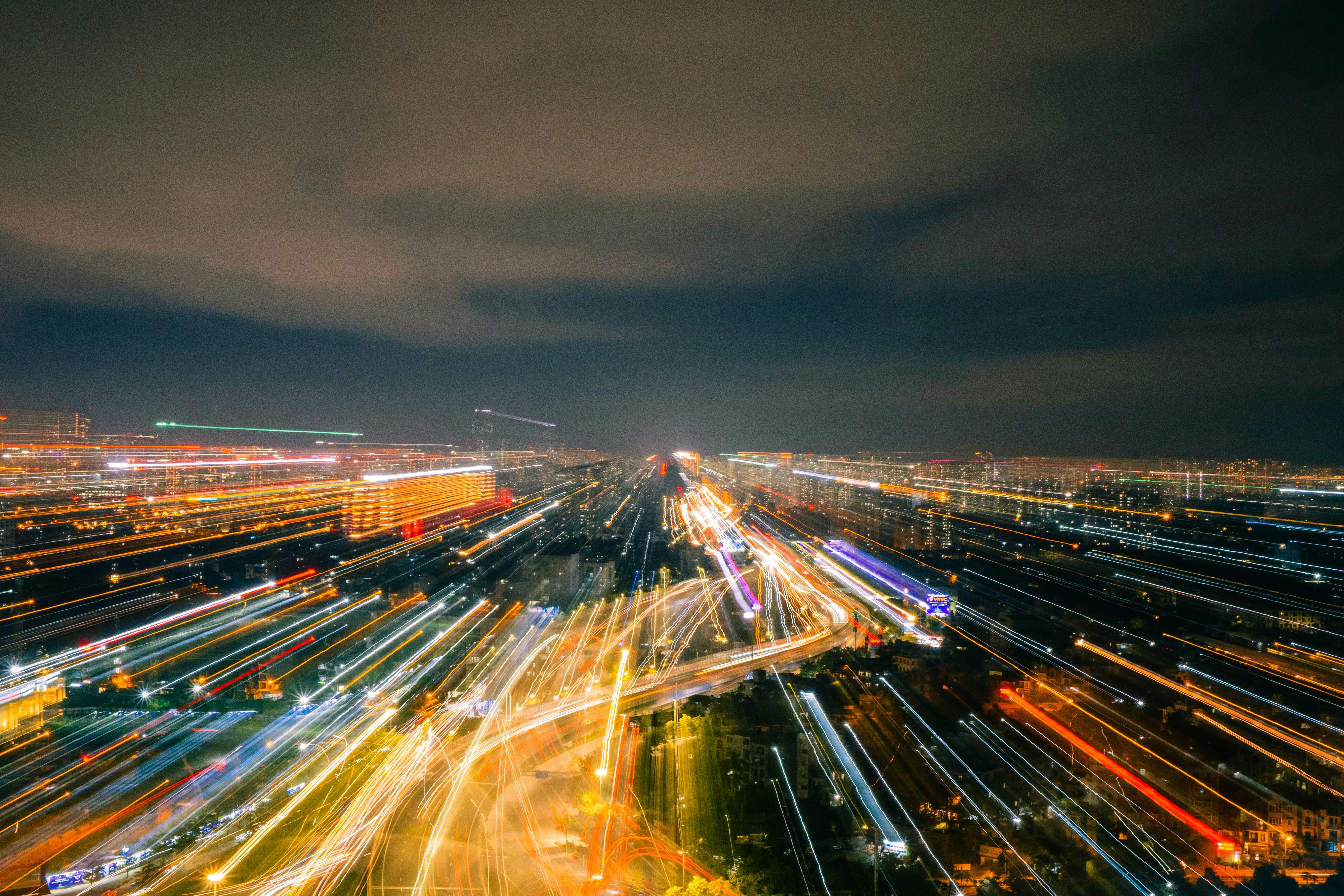 An aerial view of a city at night photo – Free City Image on Unsplash
