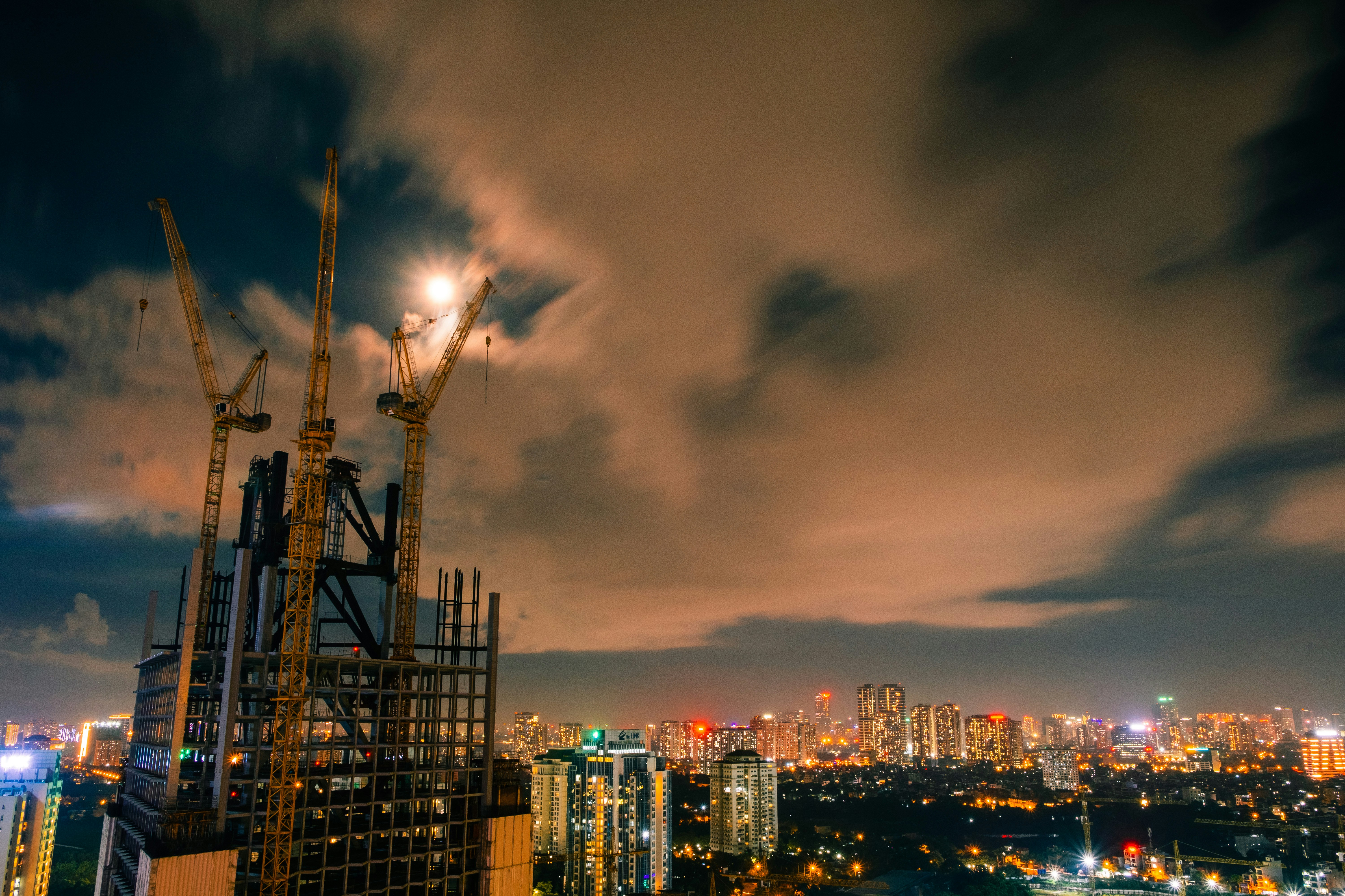 A view of a city at night from a high rise photo – Free City Image on ...