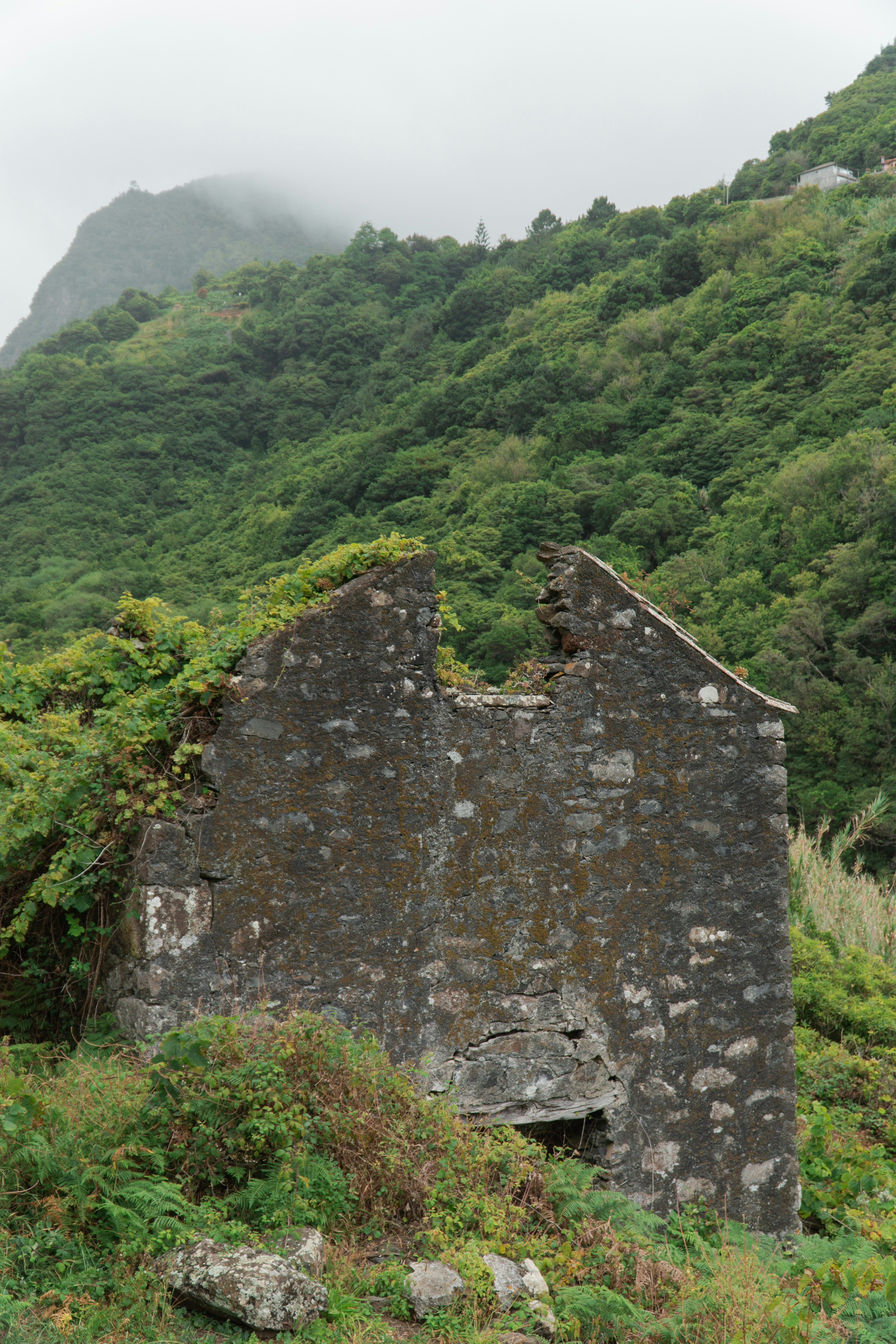 An old building in the middle of a mountain