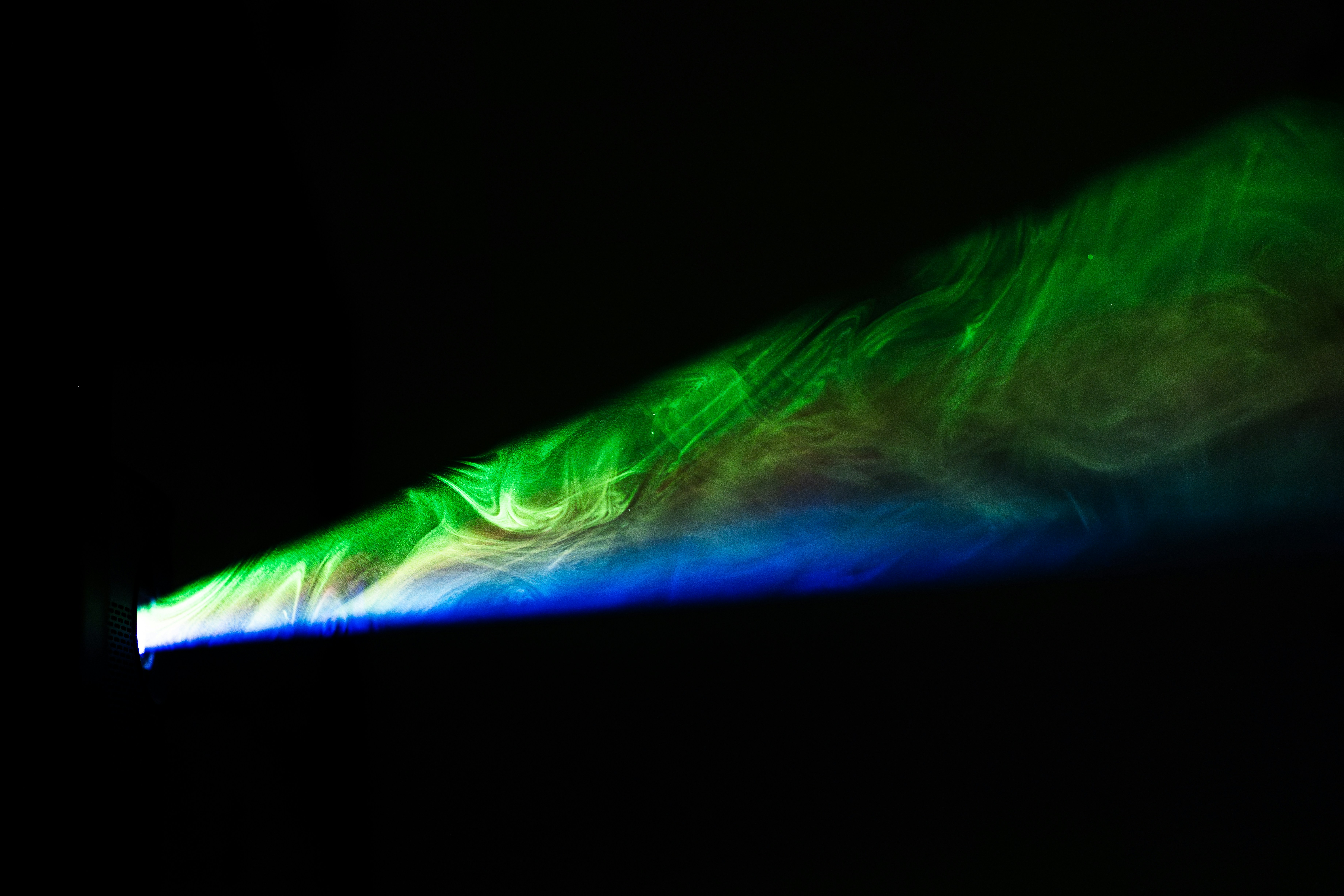 Narrow Spectral Curtain: Green Veils in a Blue Beam