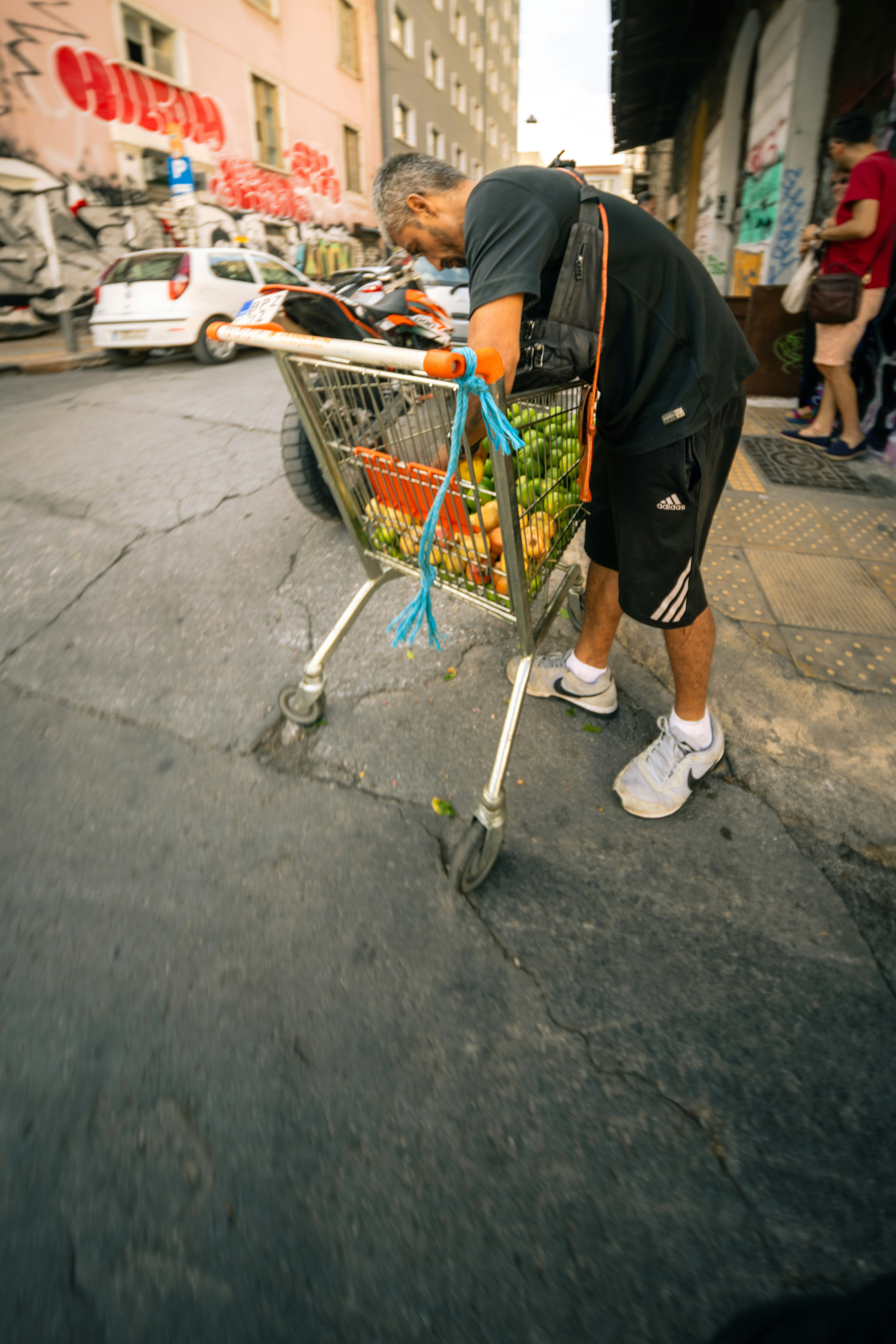 Leaned Over in the Alley: A Street Cart Bursting with Produce