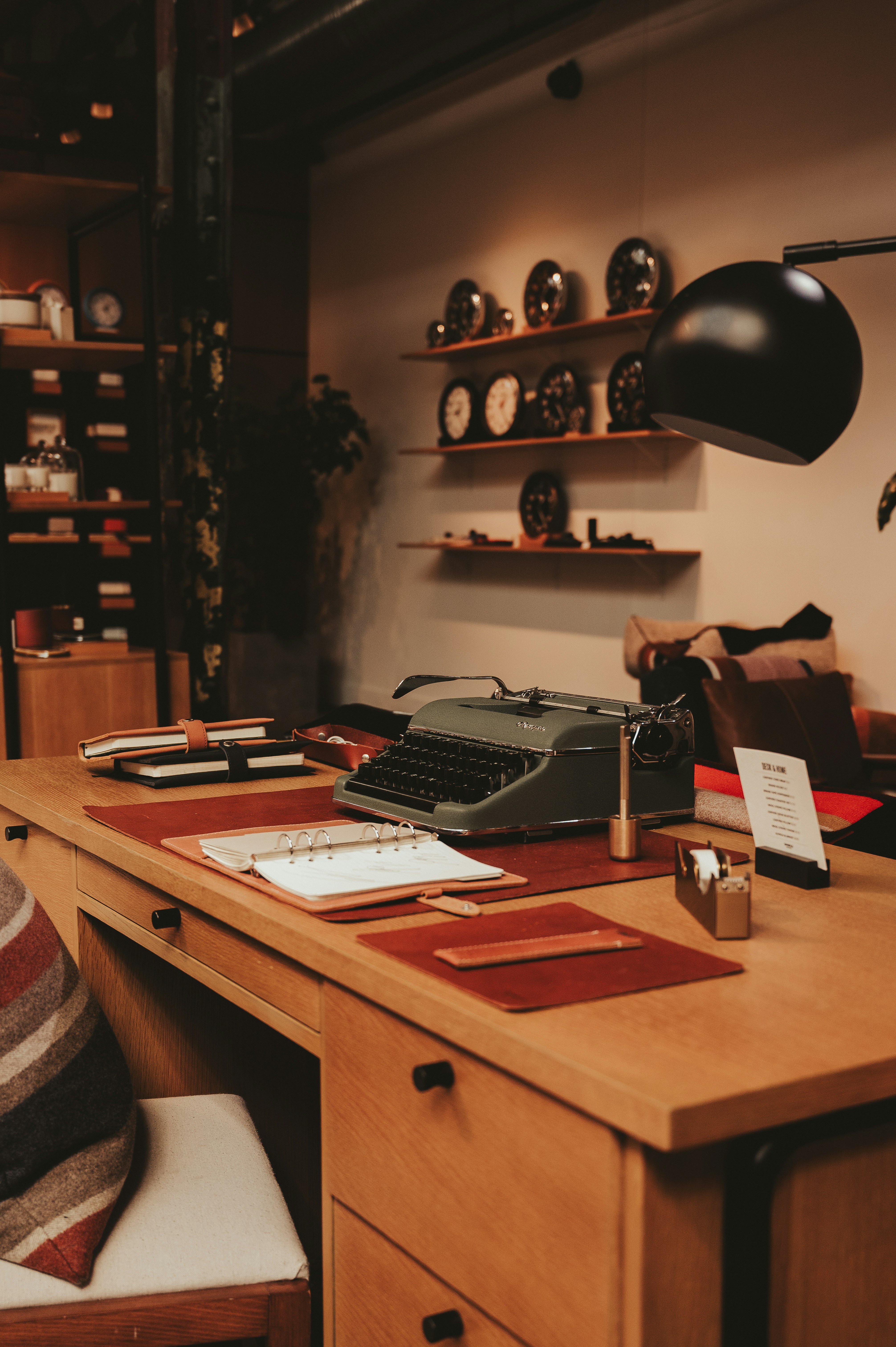 A desk with a chair and a typewriter on it photo – Free Mi Image on ...