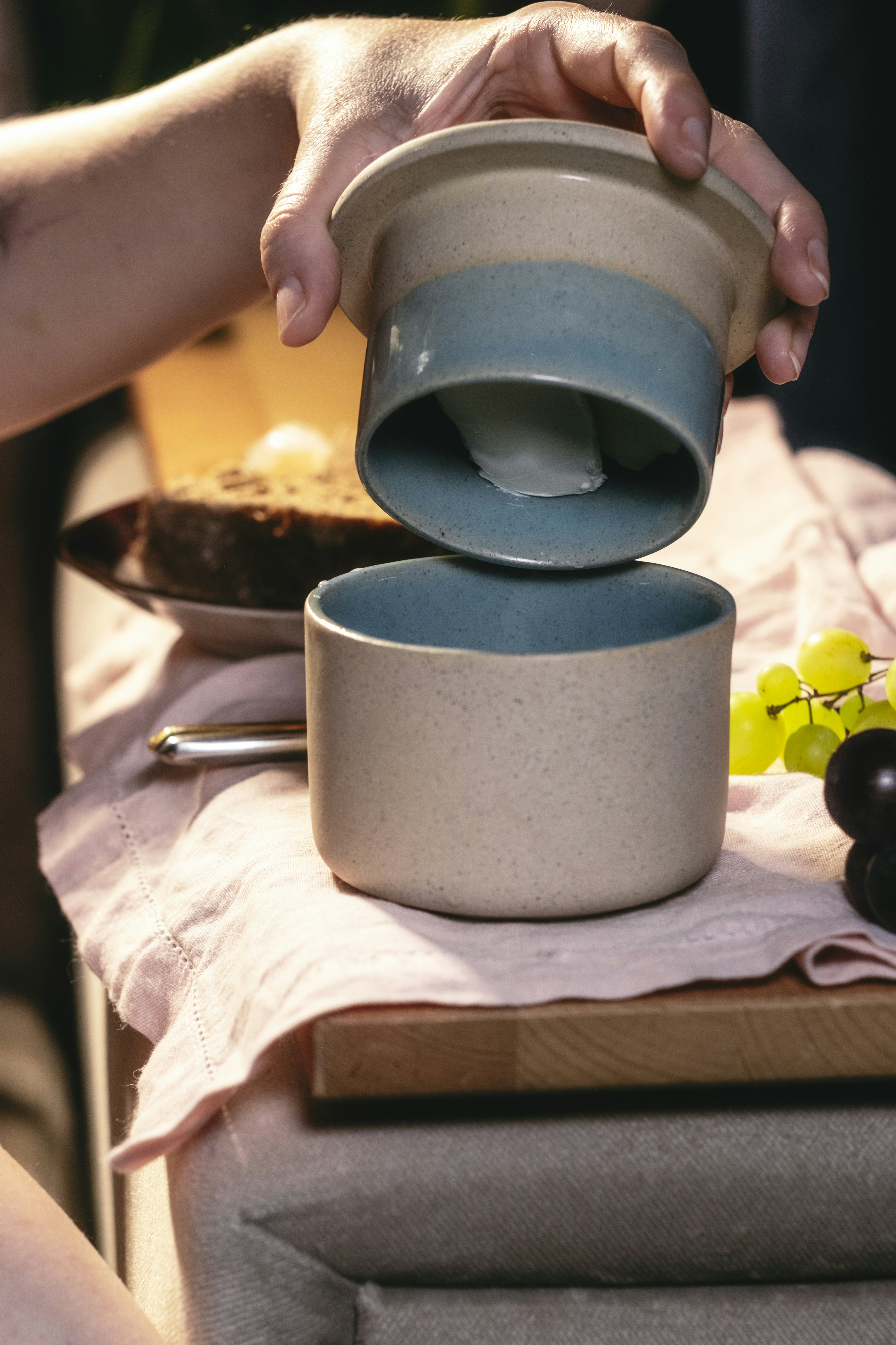 Pouring ceremony: stacked ceramic bowls meet a quiet tasting scene