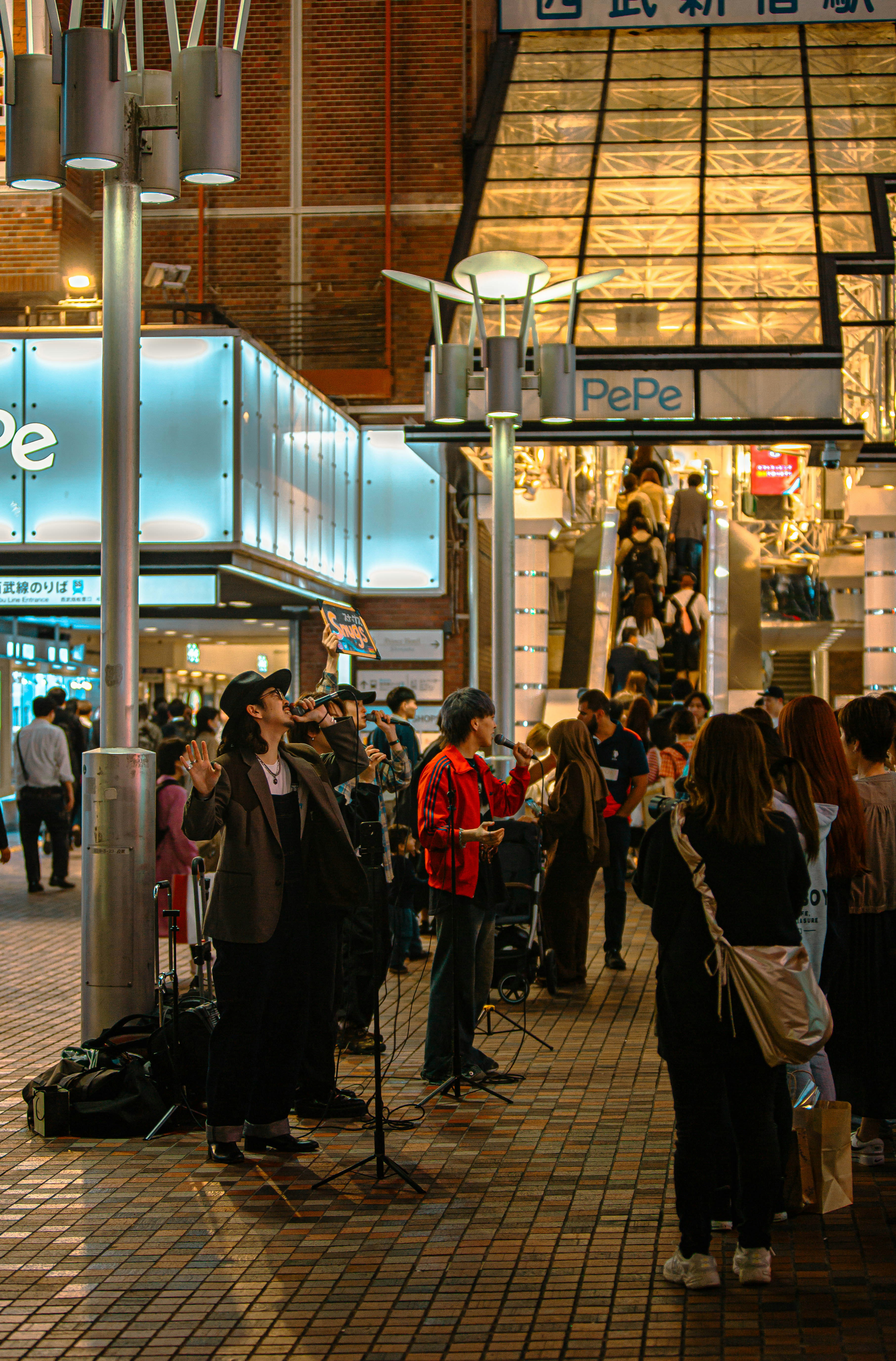 Street Buskers Under Neon Canopy: A Night at the Pedestrian Bazaar