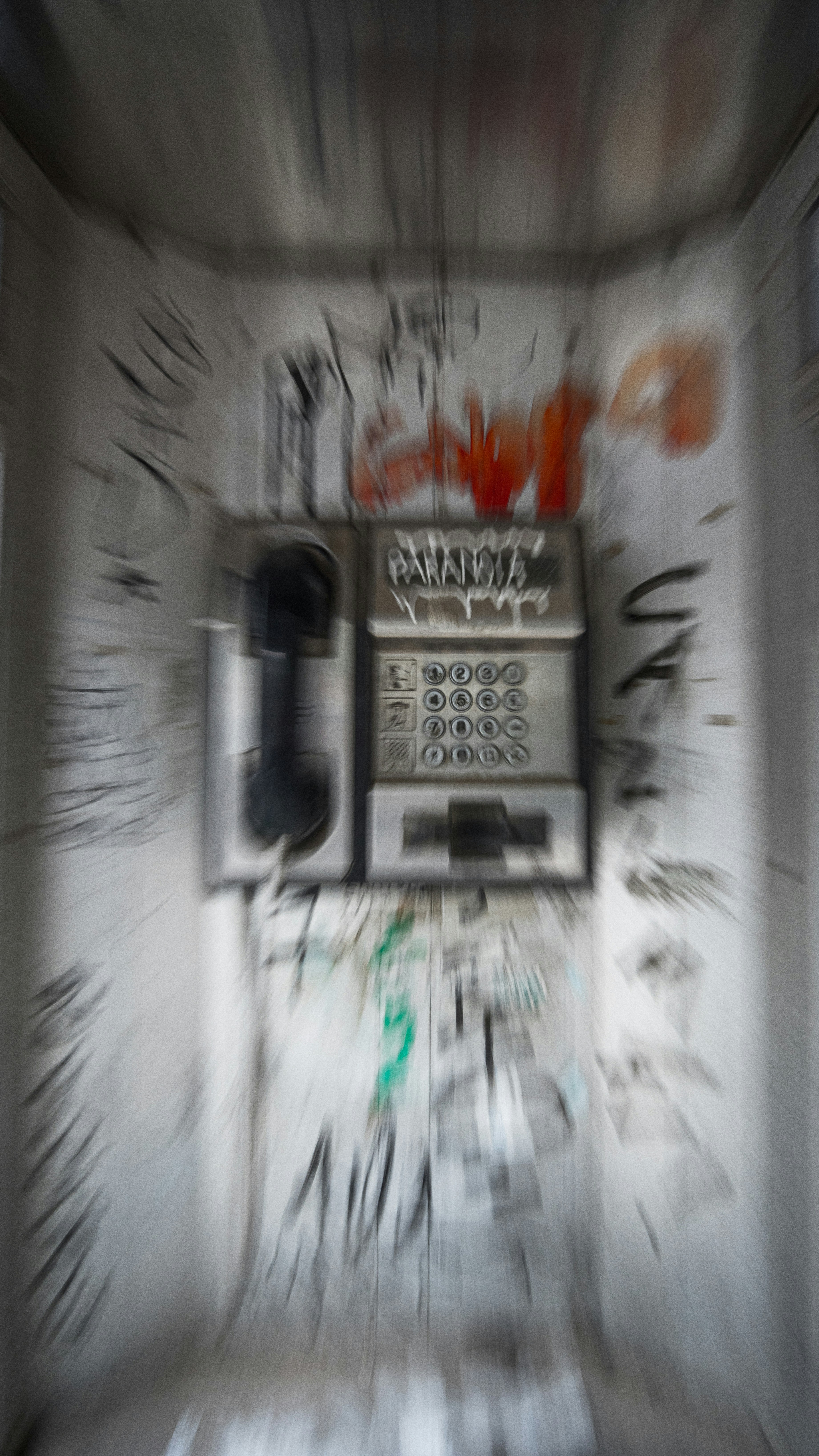 Center-Stage Payphone Amid a Graffiti Vortex
