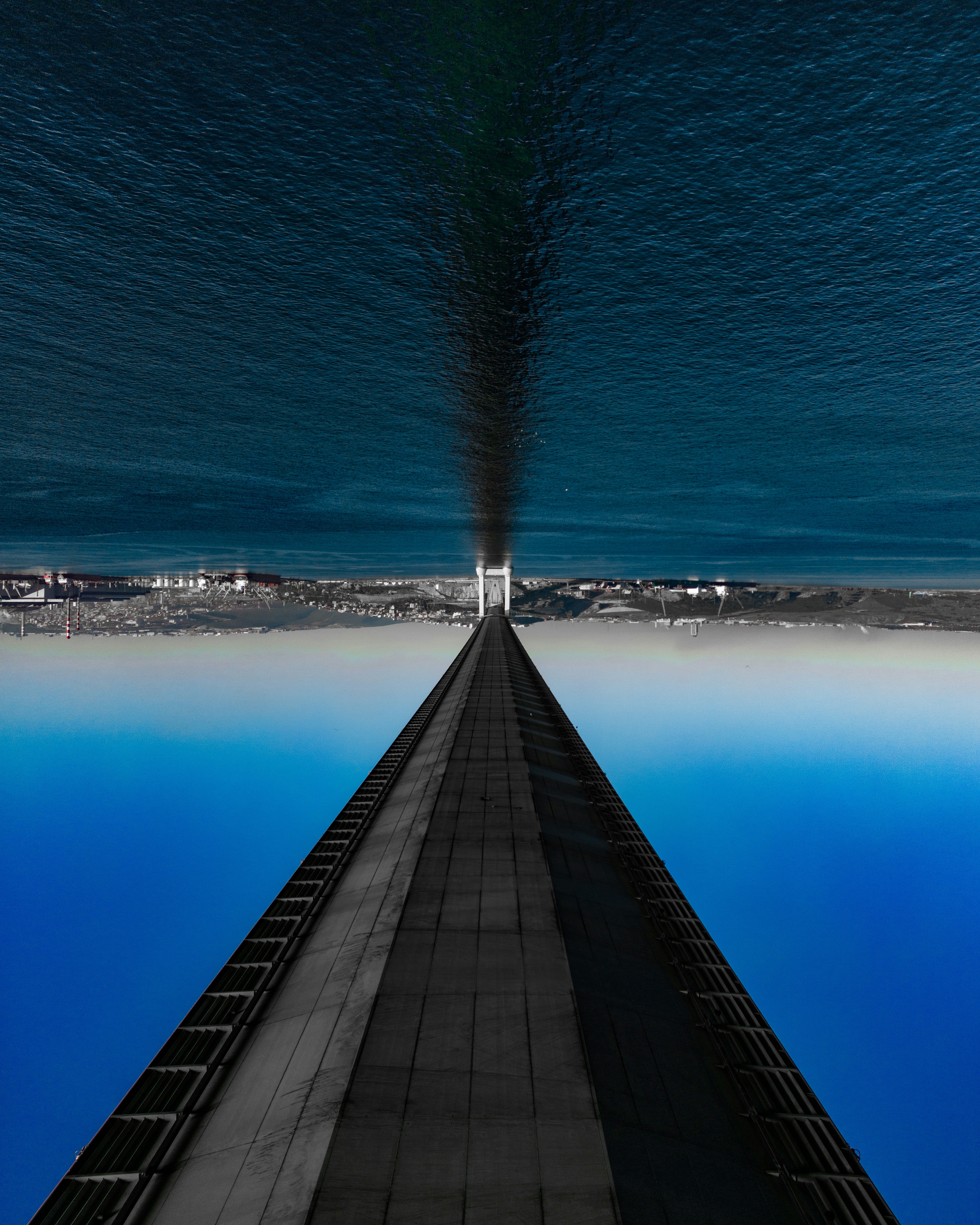 Vanishing Spine: A Central Pier Reaching the Distant Horizon