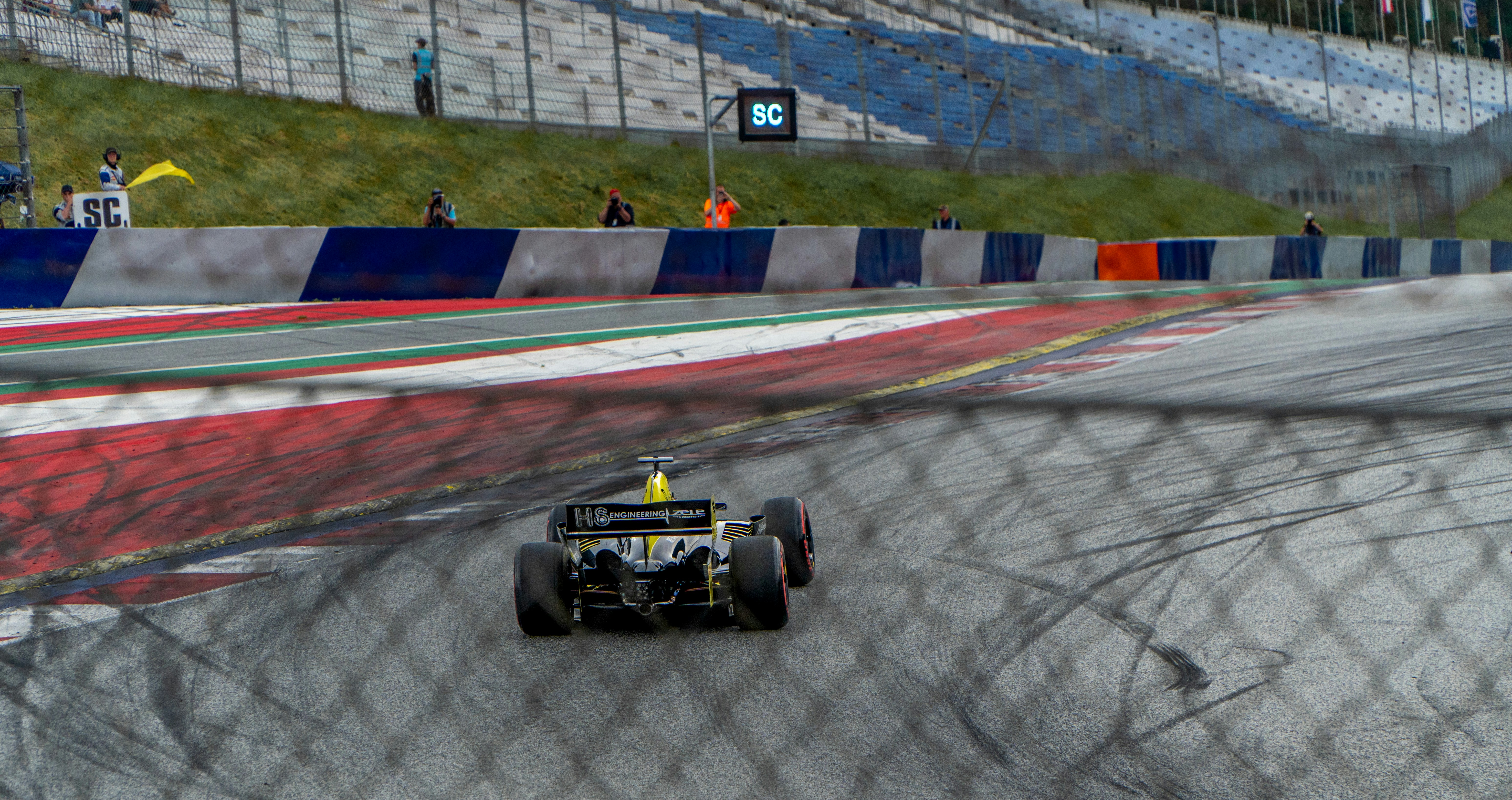 This photo shows an amateur classic car exiting the first corner of the Red Bull Ring in Spielberg Austria. Photo taken with Sony a6700 on the 8th of June 2024.