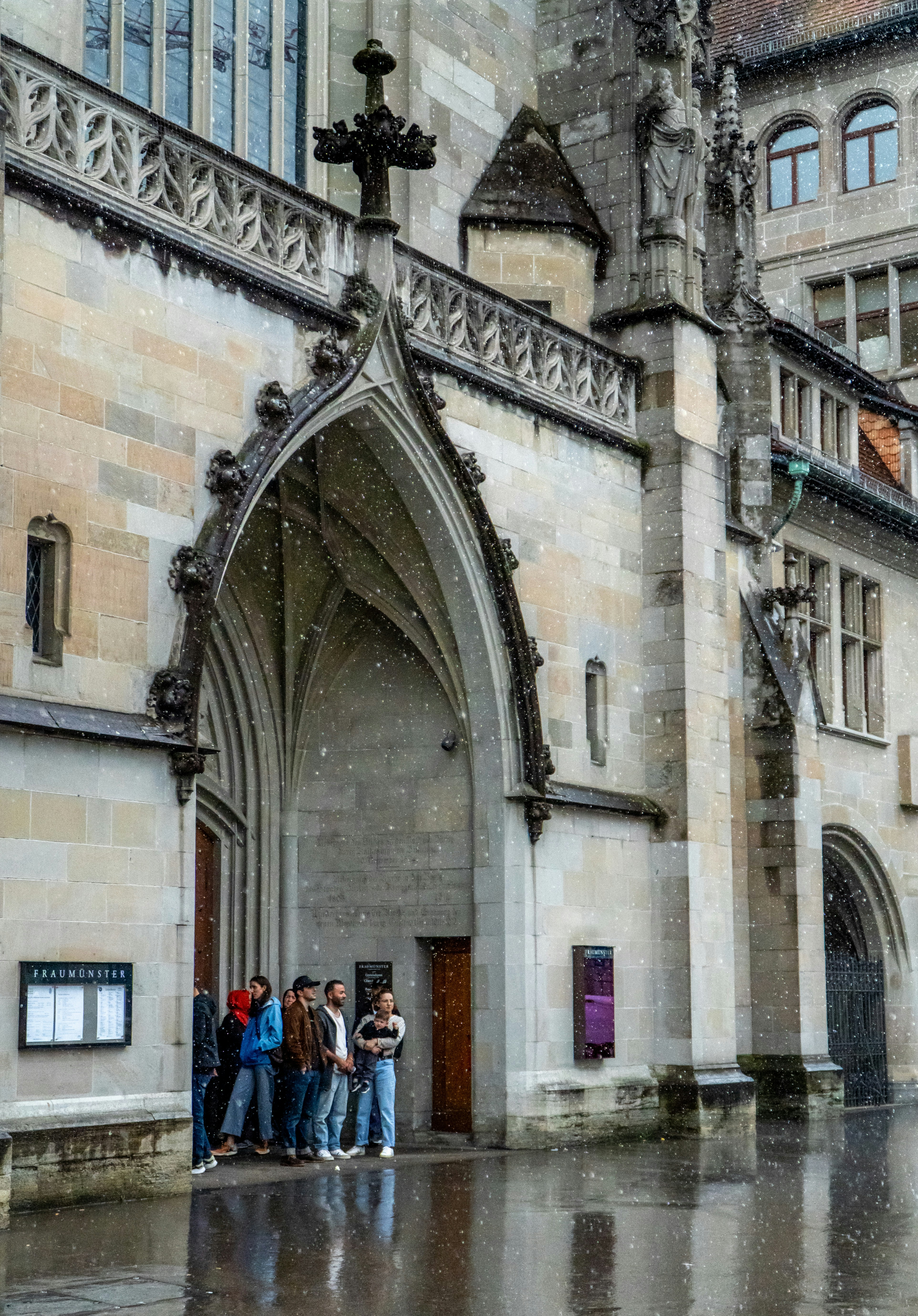 Winter Light at the Gothic Portal: A Small Group Pause Under the Arched Entrance