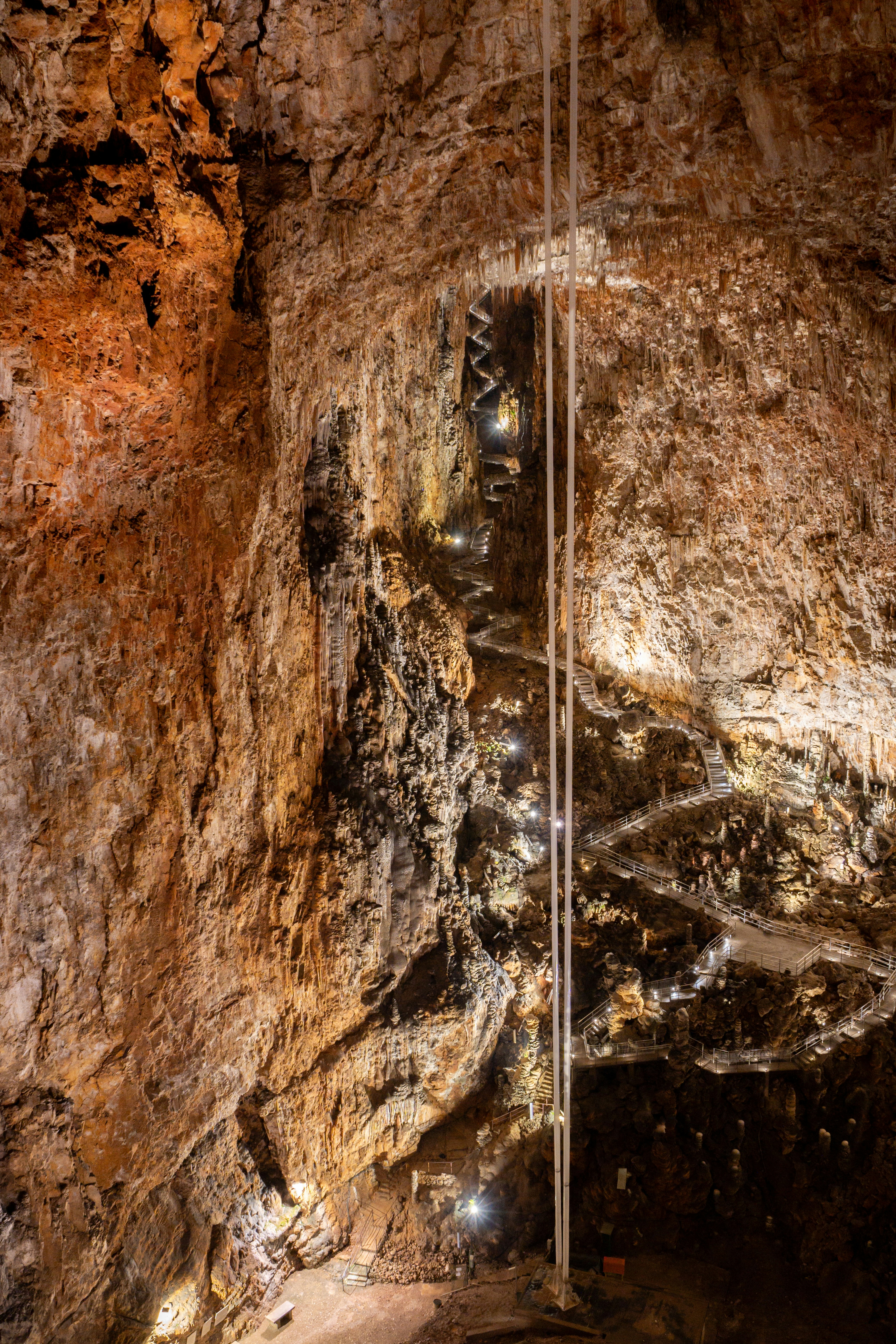 Limestone Cathedral: A Vertical Path of Light Through the Cavern