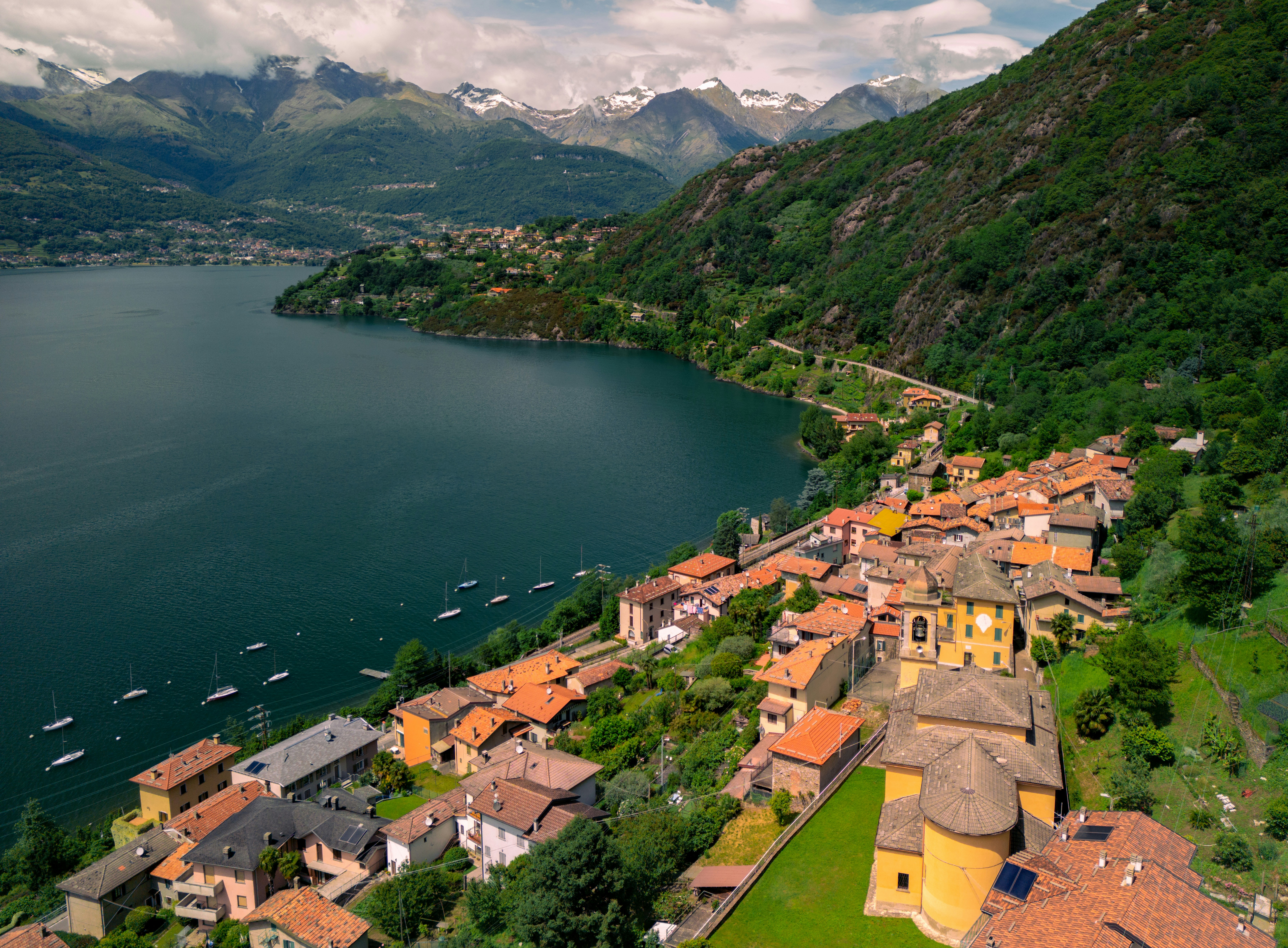An aerial view of a village by the water photo – Free Dorio Image on ...