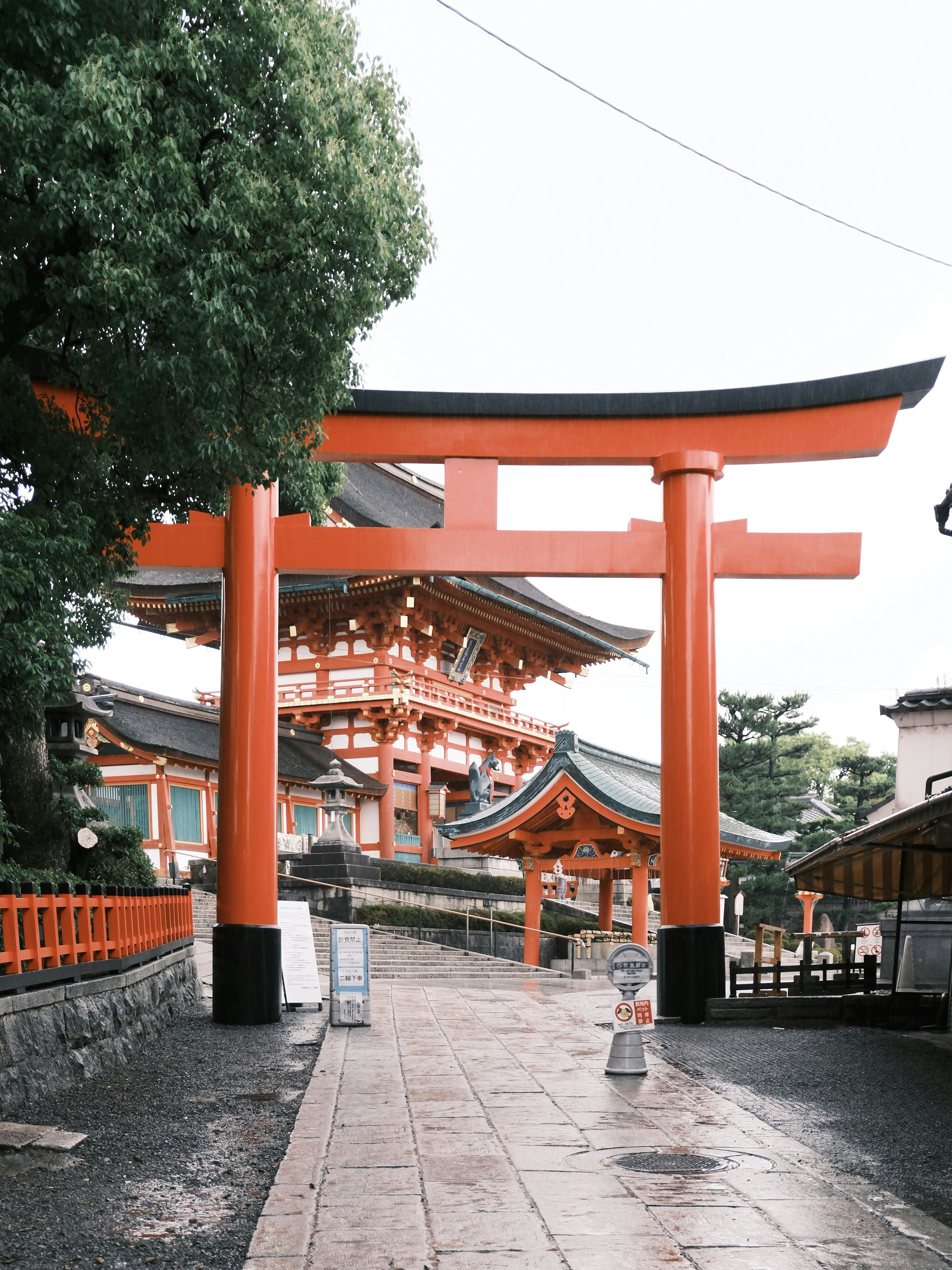 A large orange gate in front of a building photo – Free Building Image ...