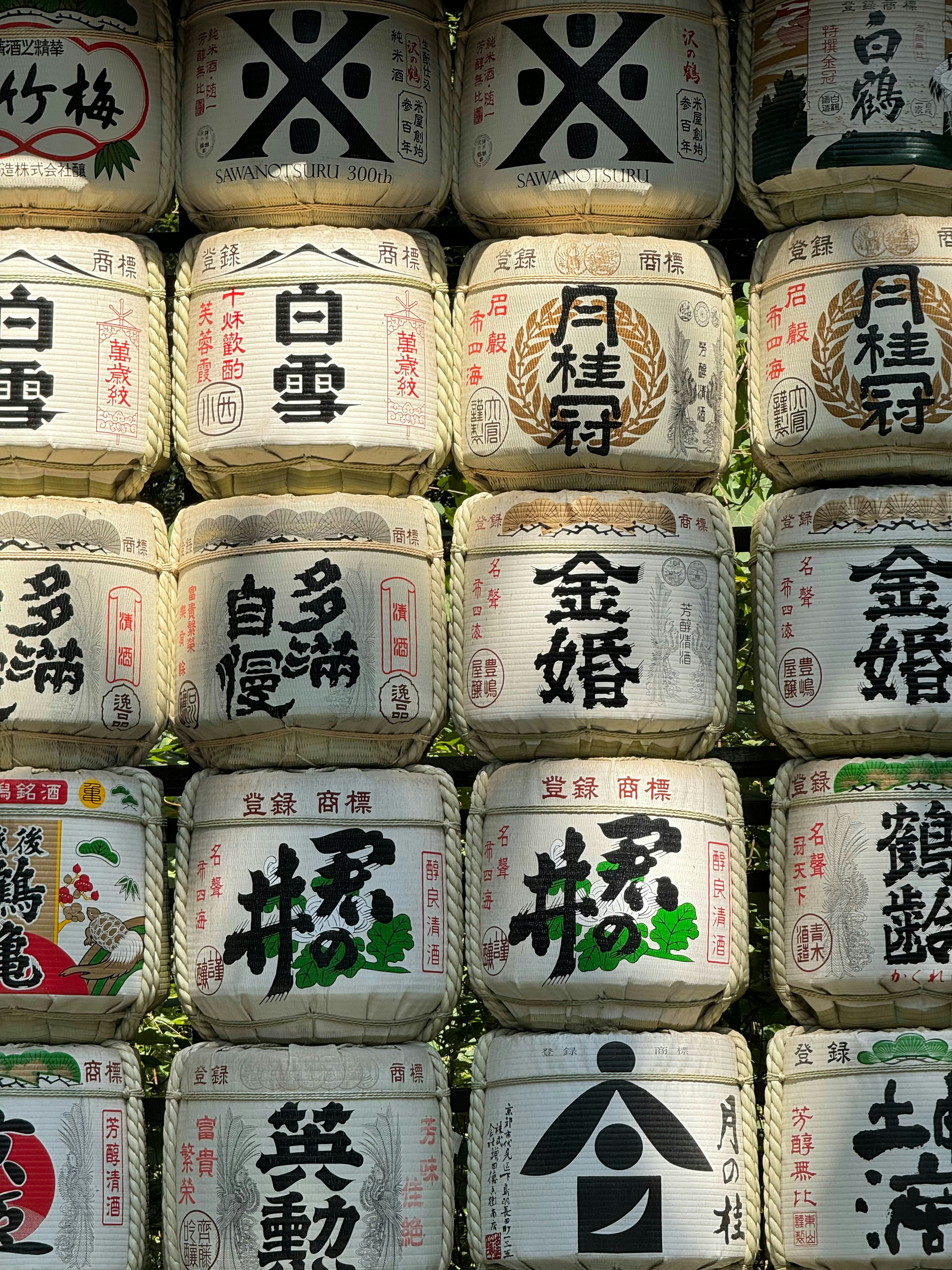 Kanji in Rows: A Geometric Wall of Sake Barrels