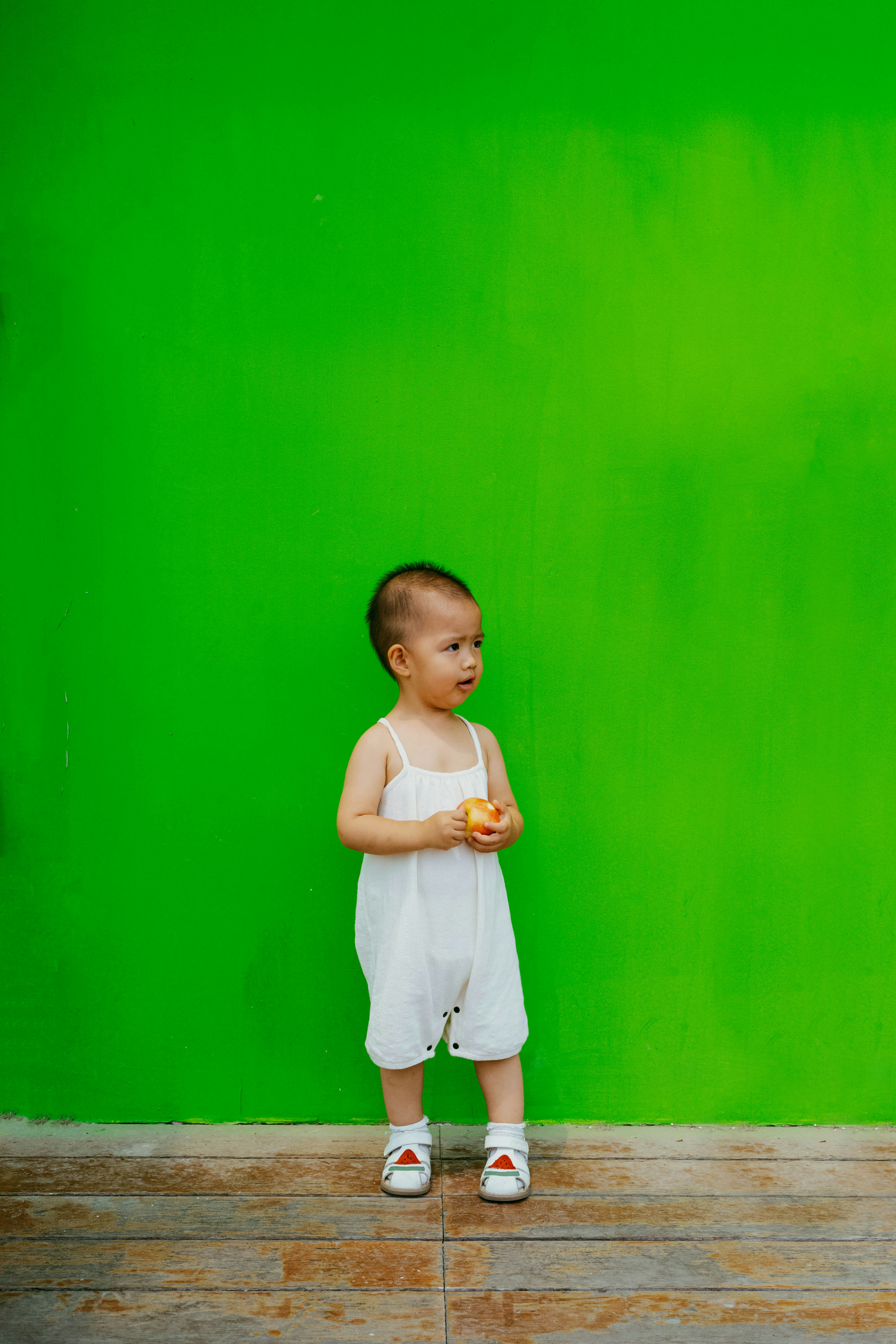 Lime Backdrop Portrait: A Toddler in White