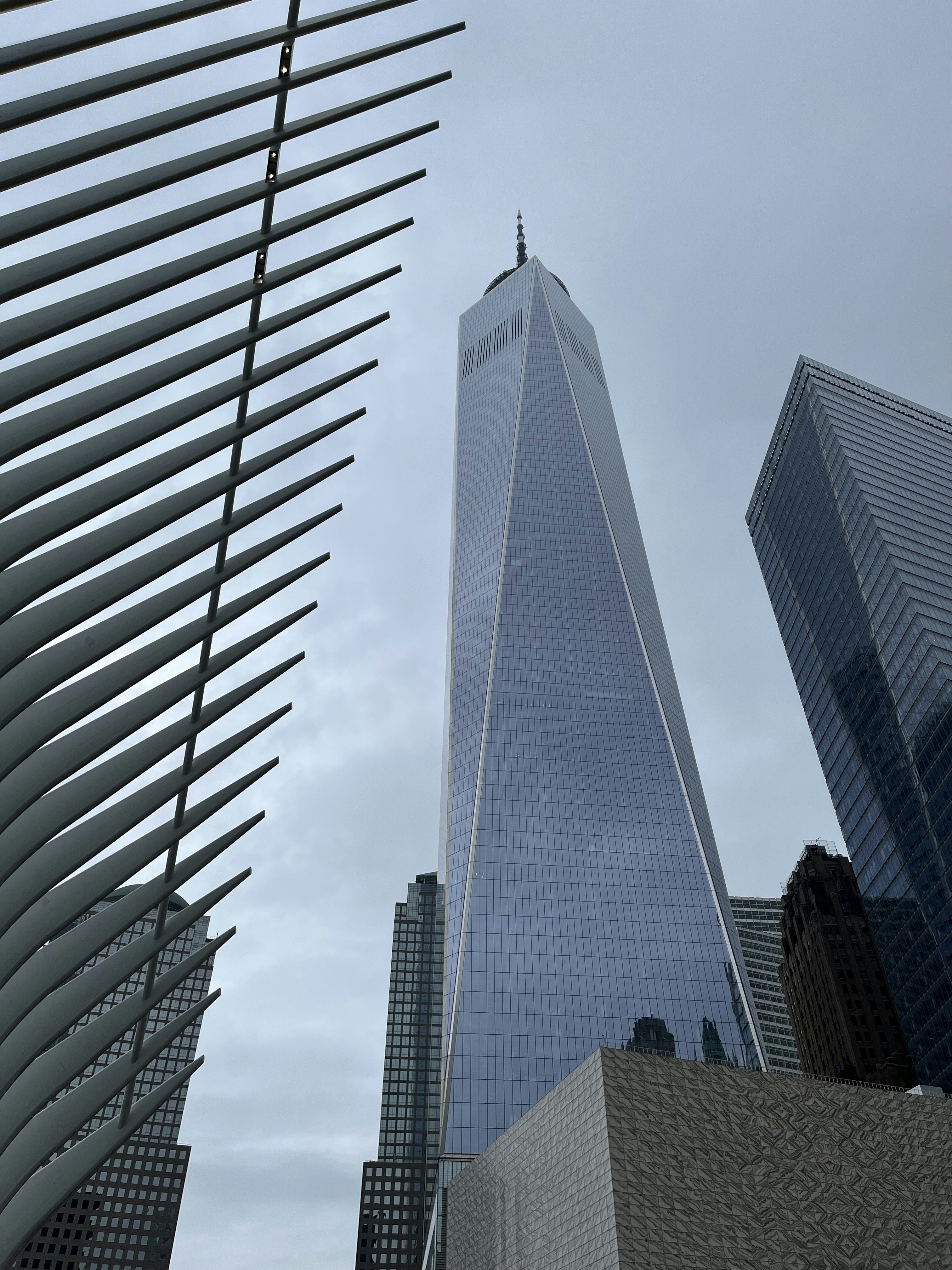 One World Trade Center in New York City on a gray day.