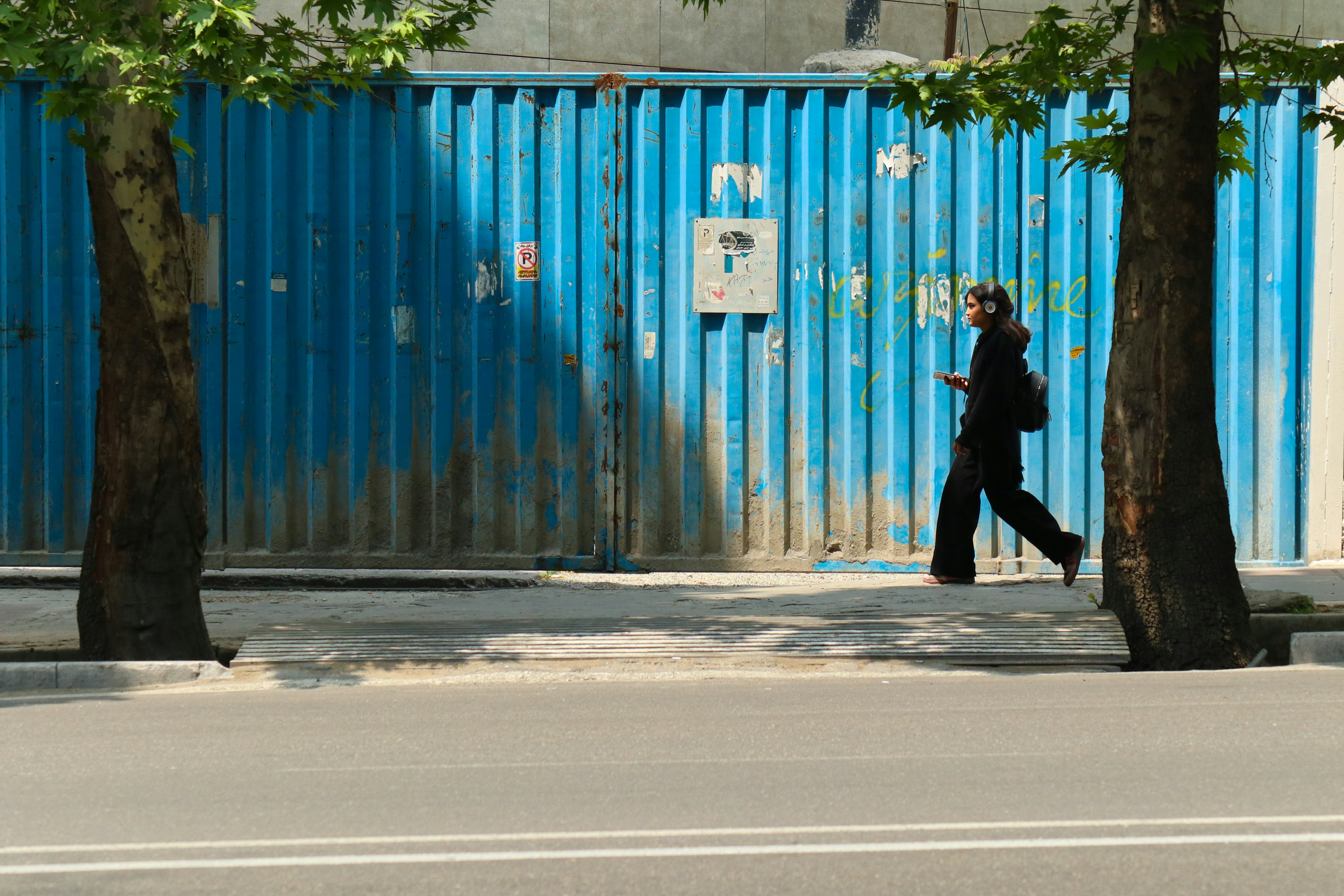 Footsteps Along a Blue Barrier