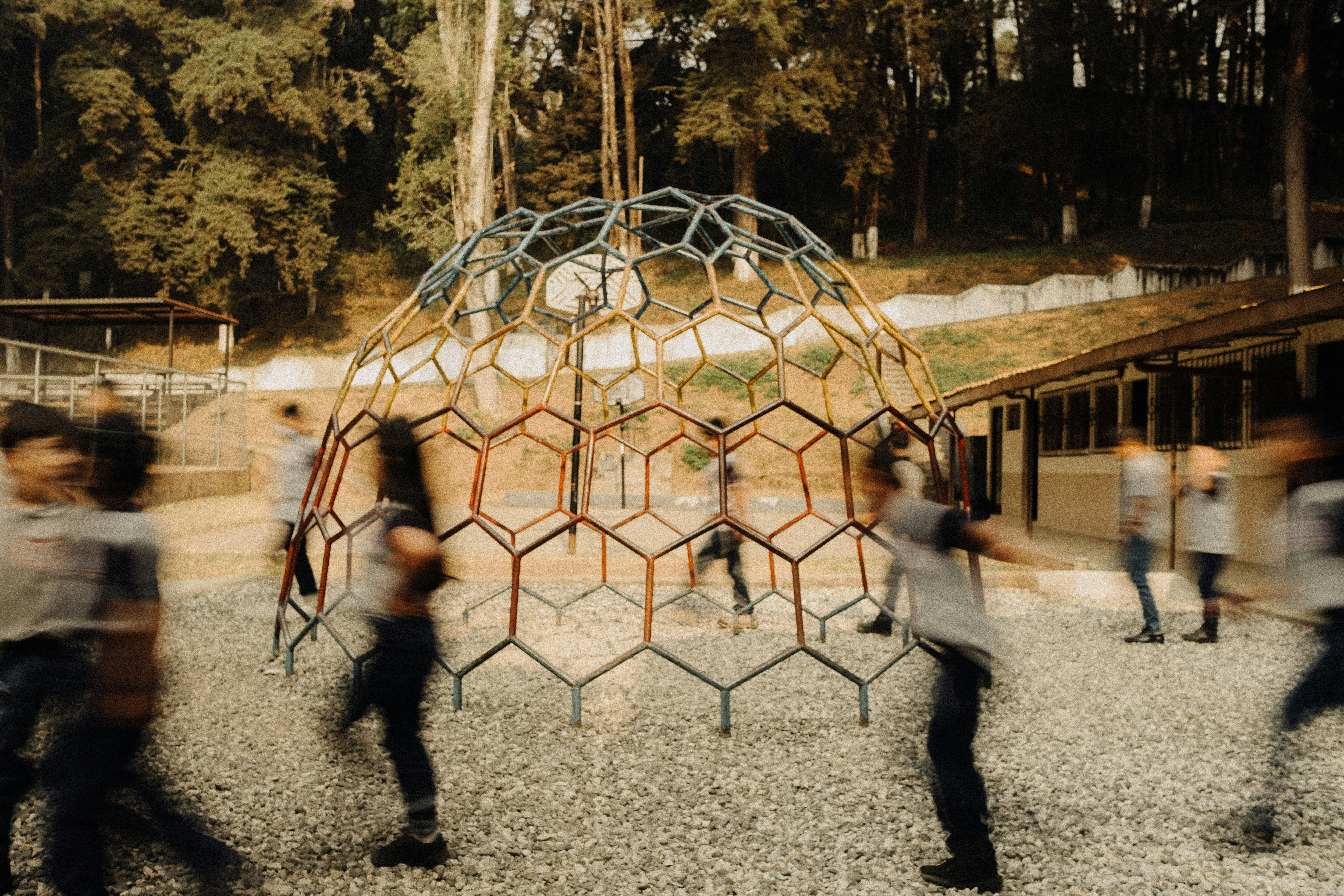 A group of people walking around a building photo – Free Organization ...