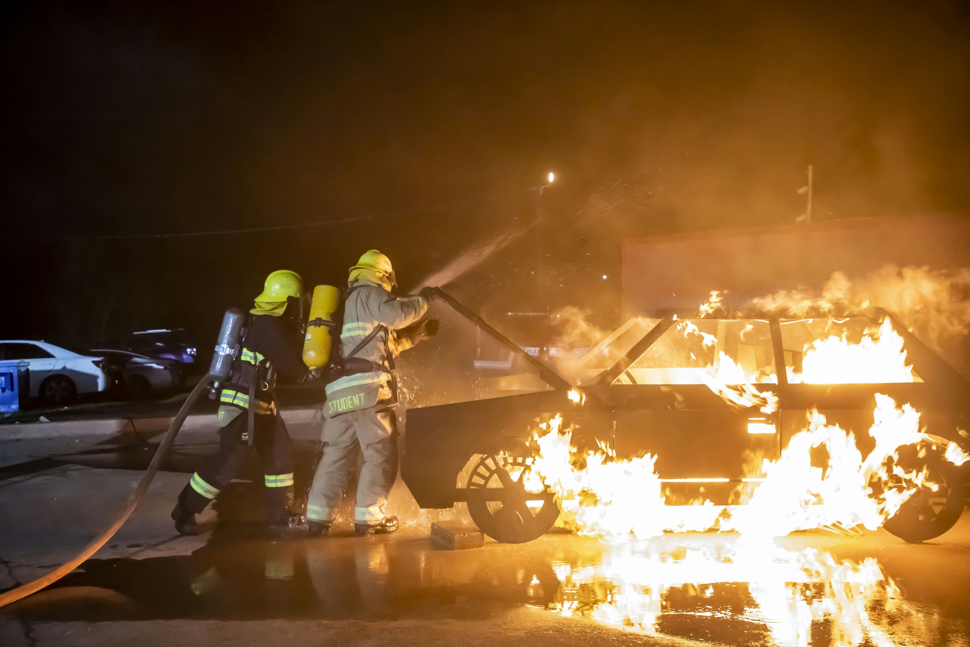 A group of men standing next to a fire hydrant photo – Free Fire Image ...