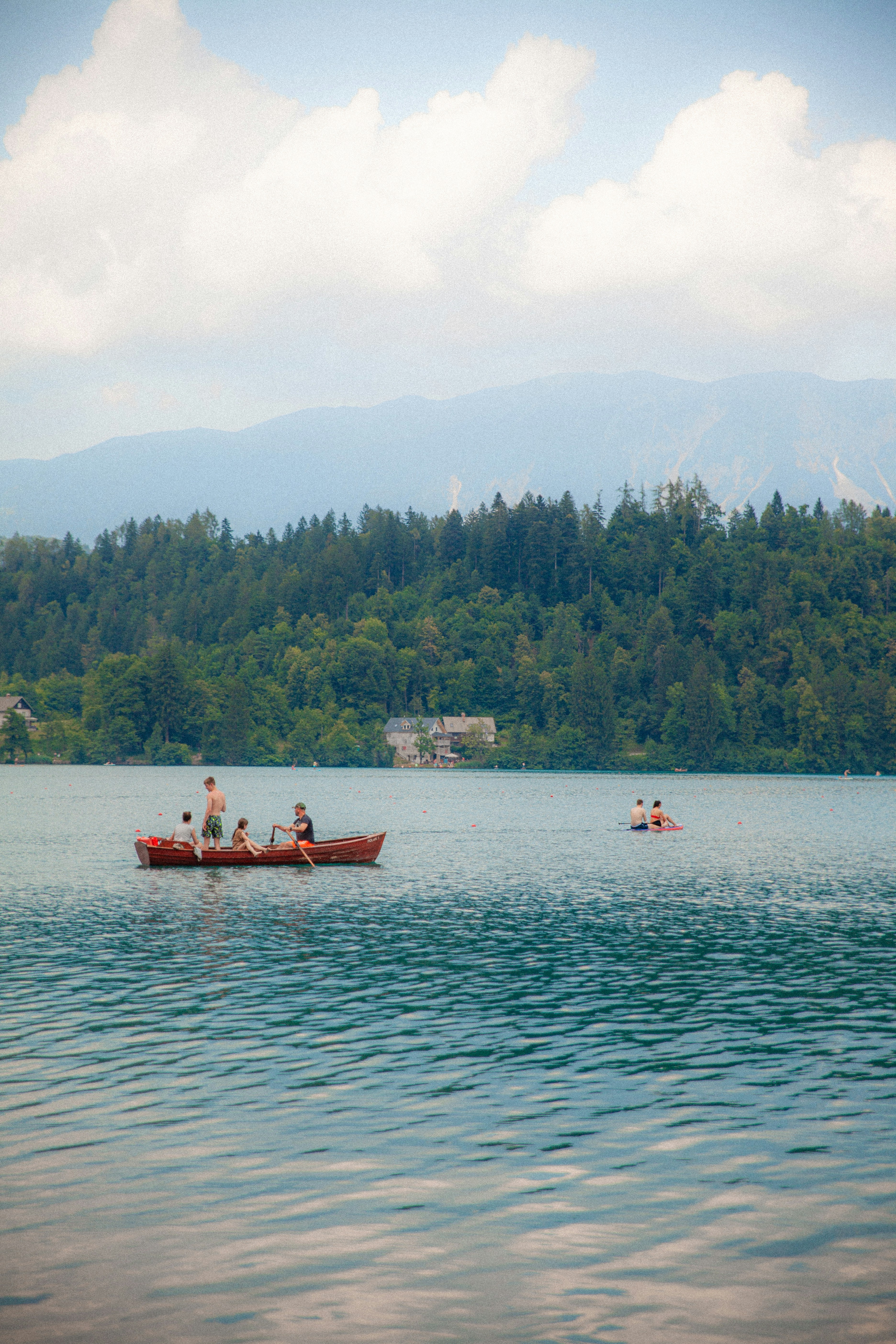 Red Rowboat on a Quiet Alpine Lake