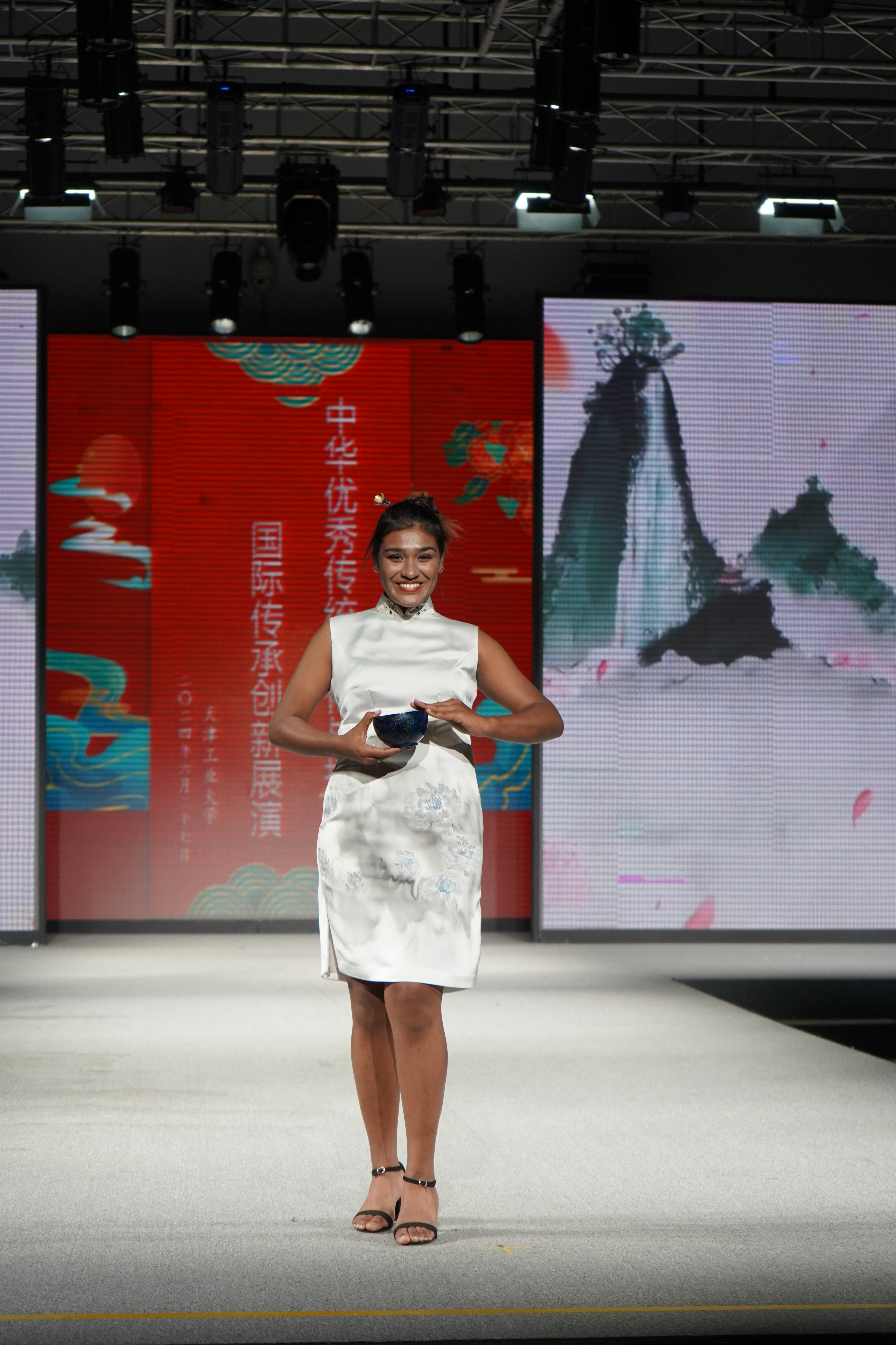 Centerstage in White Silk: A Qipao Walk Before Ink-Wash Screens
