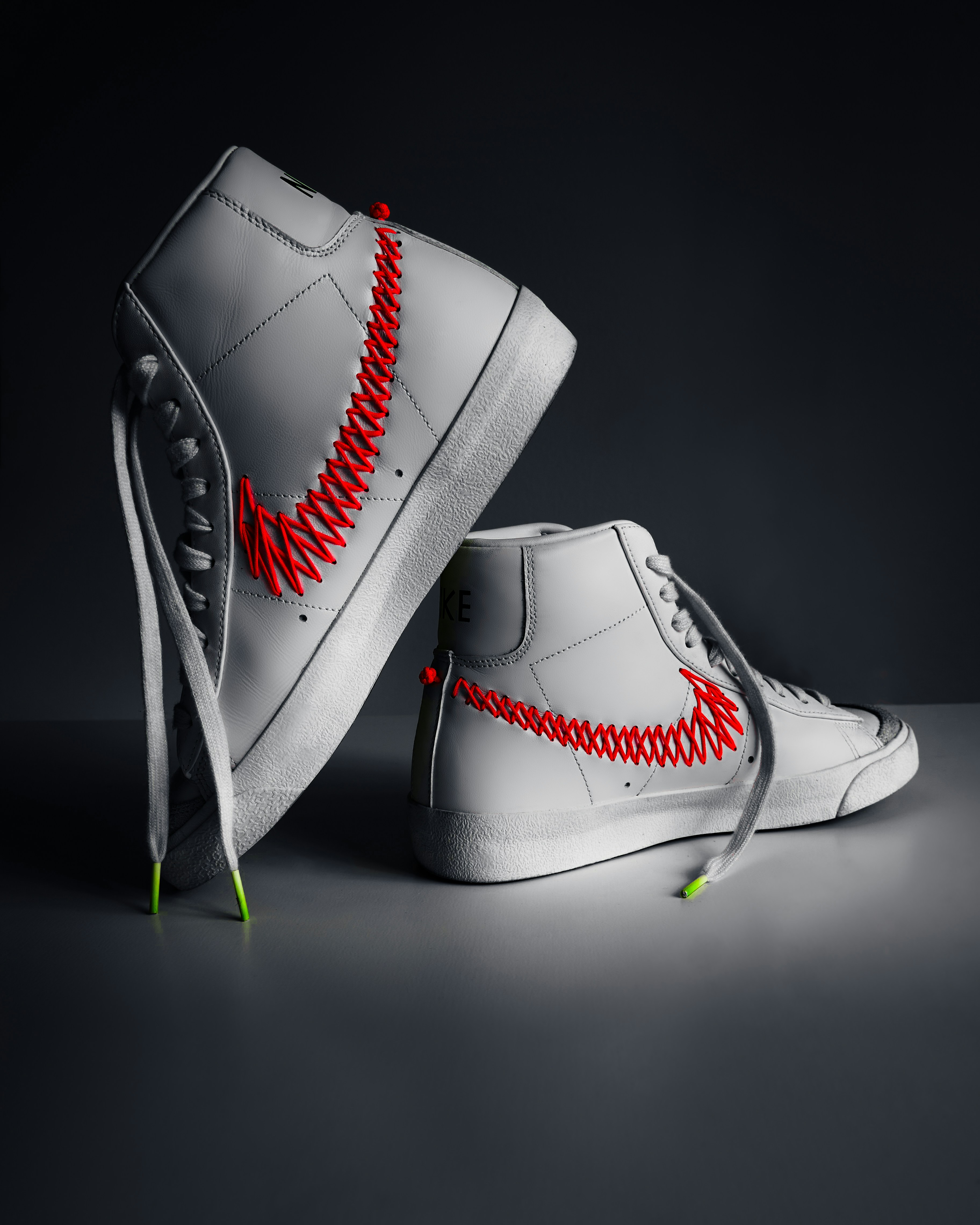 A pair of white shoes with red laces on them photo – Free Style Image ...