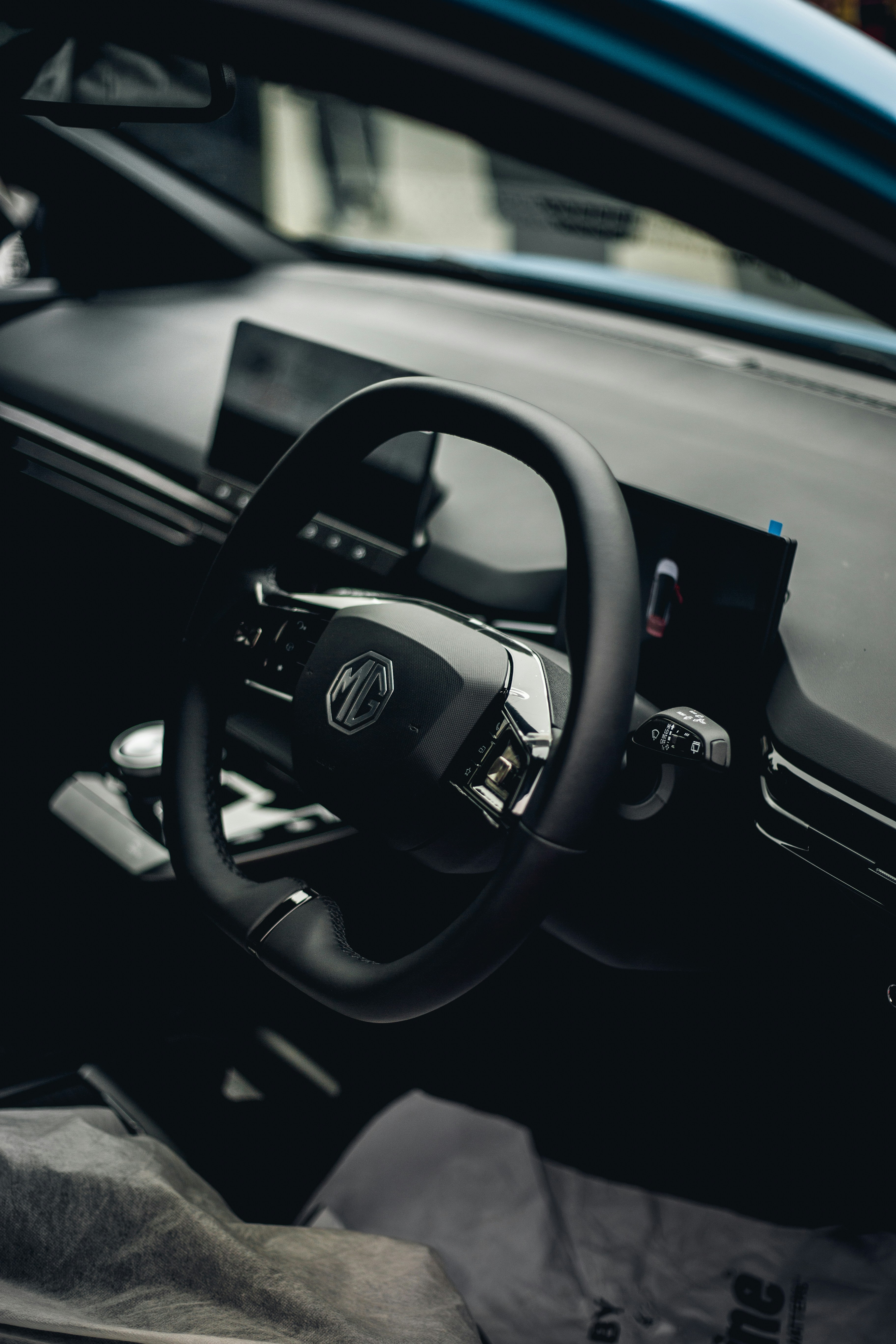 The interior of a car with a steering wheel and dashboard photo – Free ...
