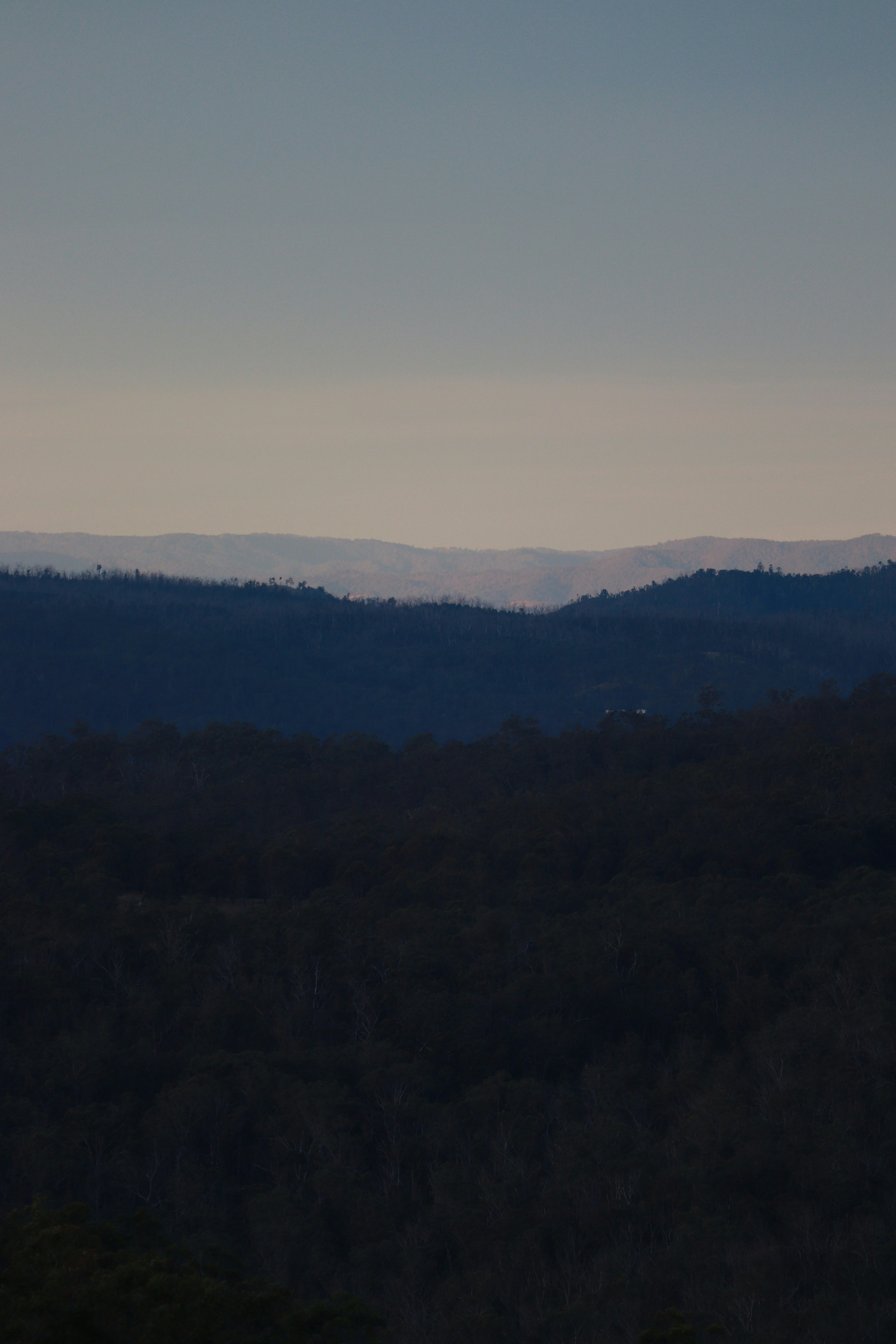 Horizon Layers: Distant Ridges Beneath a Quiet Sky