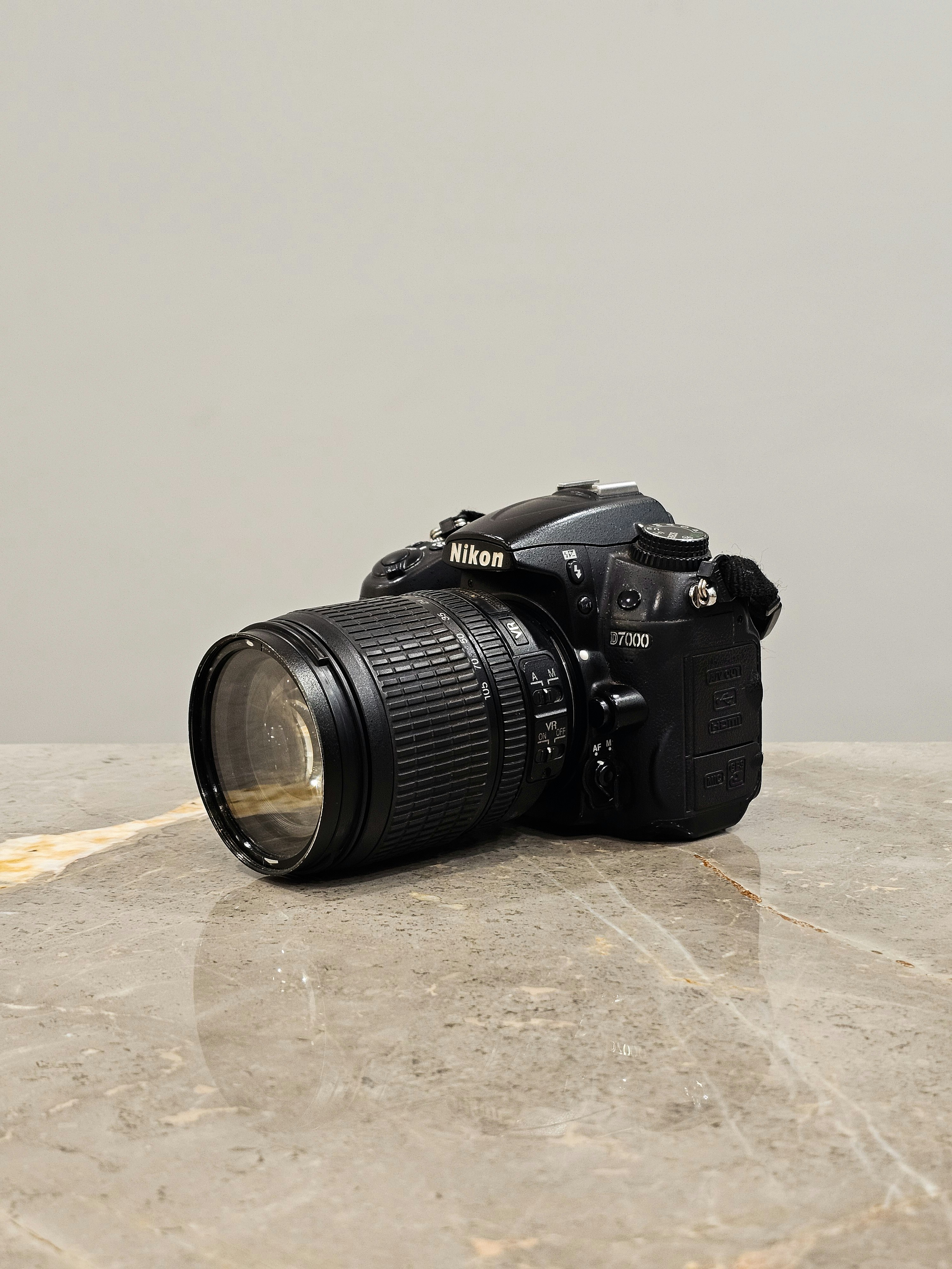 A camera sitting on top of a marble table photo – Free Photo Image on ...