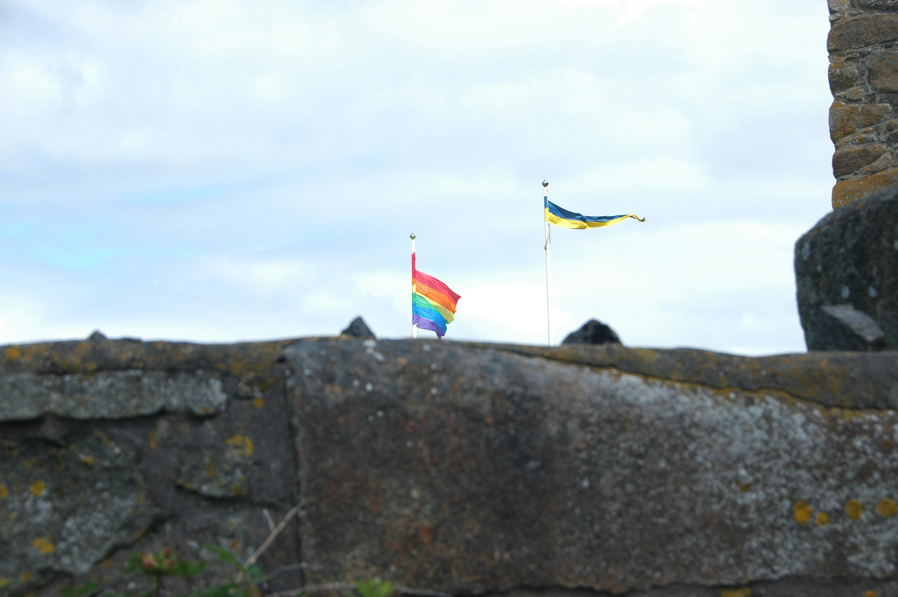 Two Flags Over a Weathered Rampart: Pride and Ukraine Against the Sea