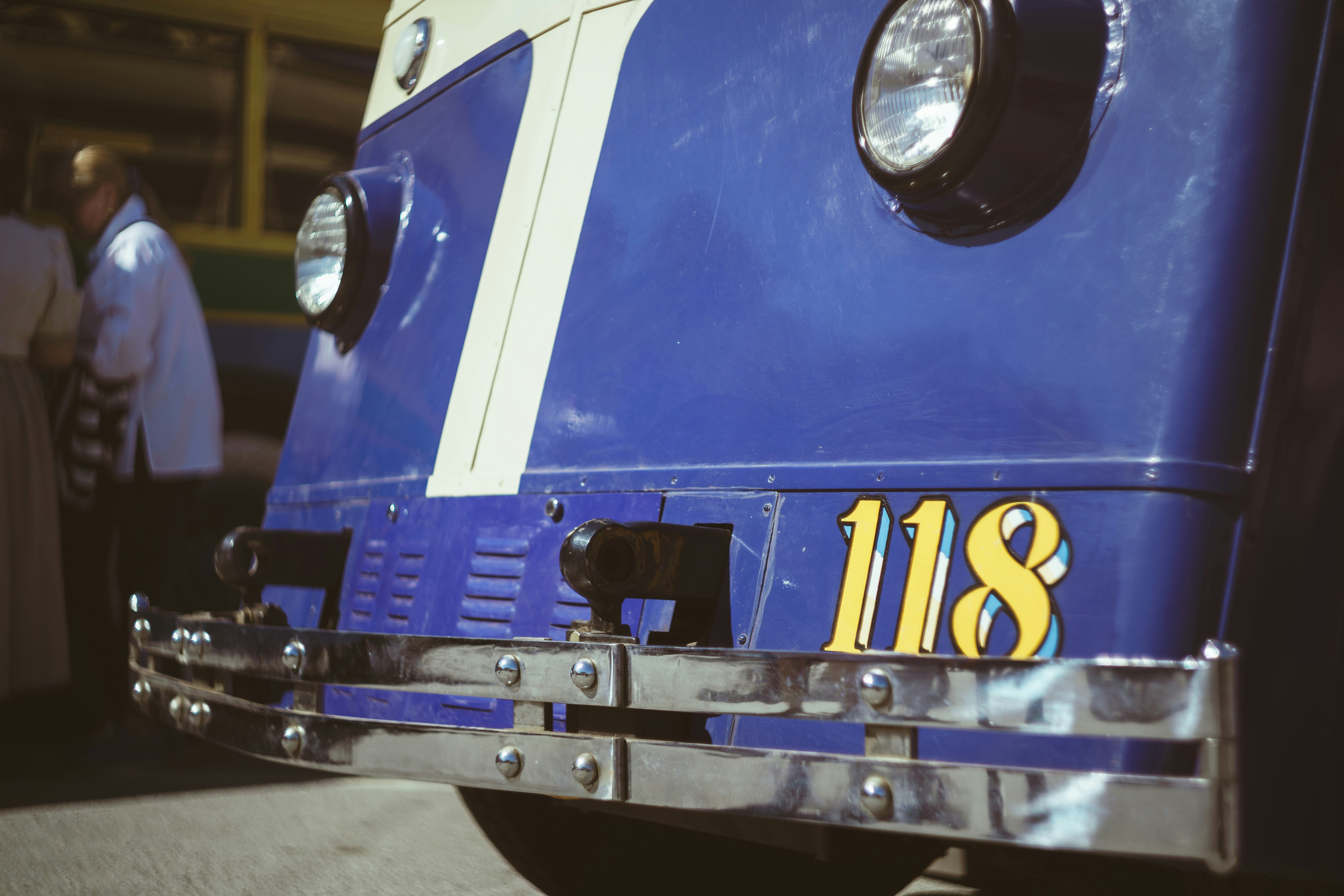 Front-End of a Cobalt Blue Locomotive: Chrome Bumper and Bold 118 Emblem