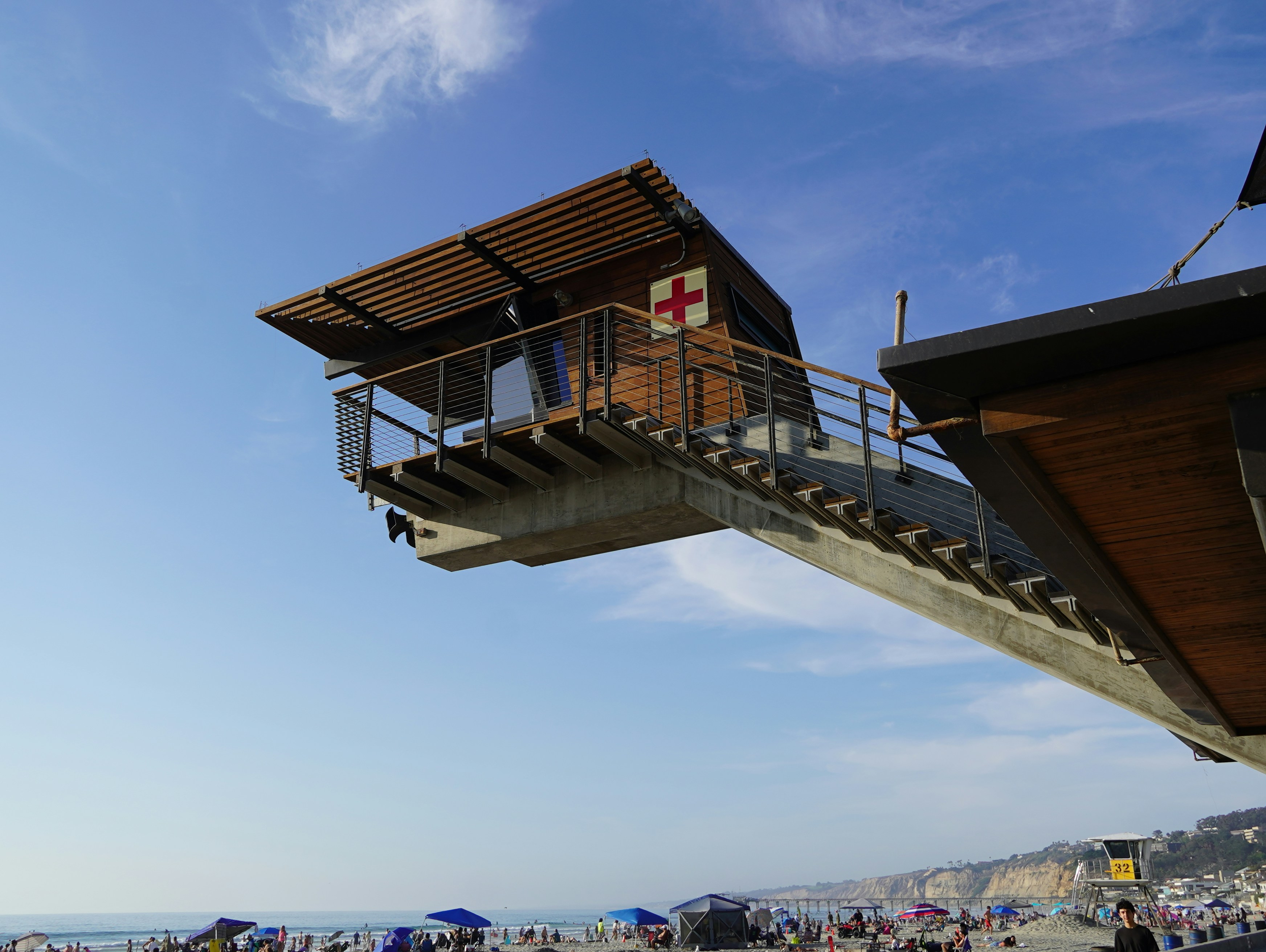 Hovering Lifeguard Lookout Over a Sunlit Beachfront