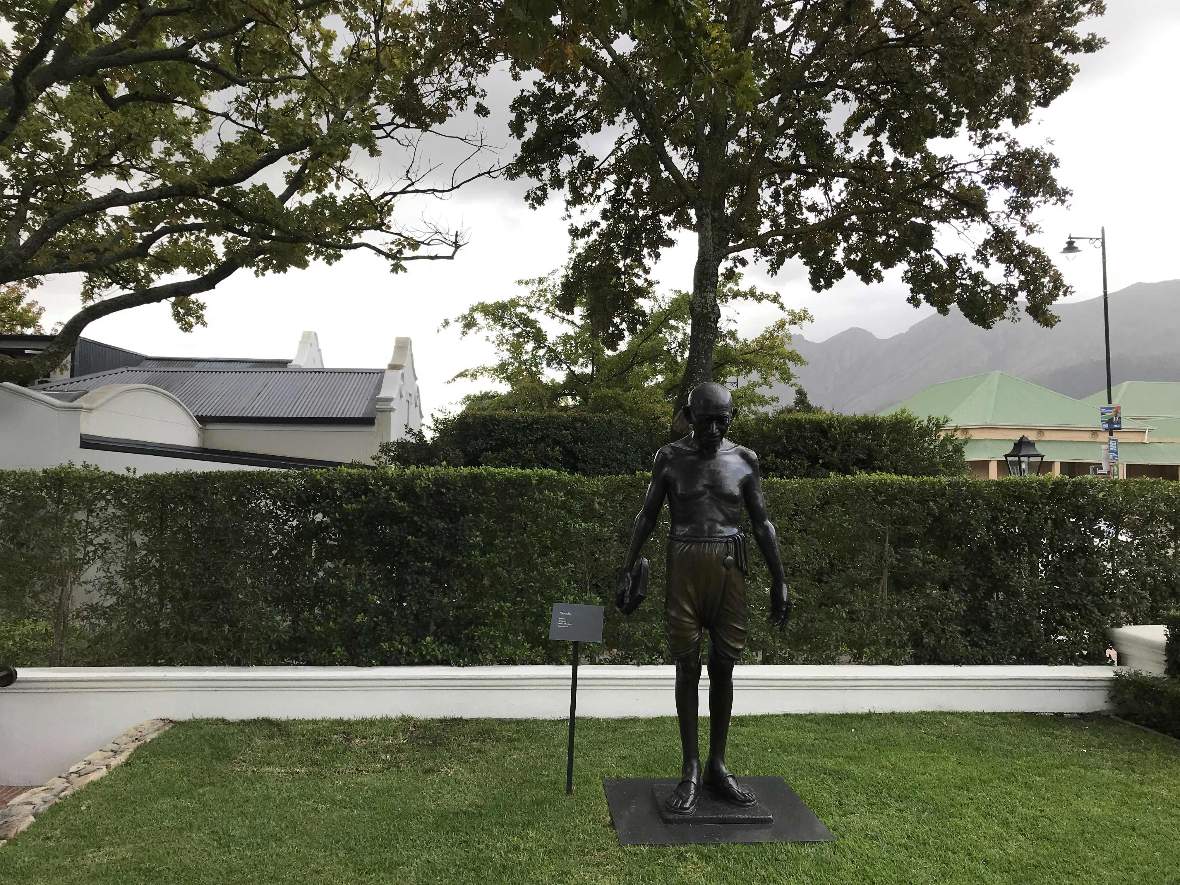Bronze Sentinel Amidst Verdant Gardens