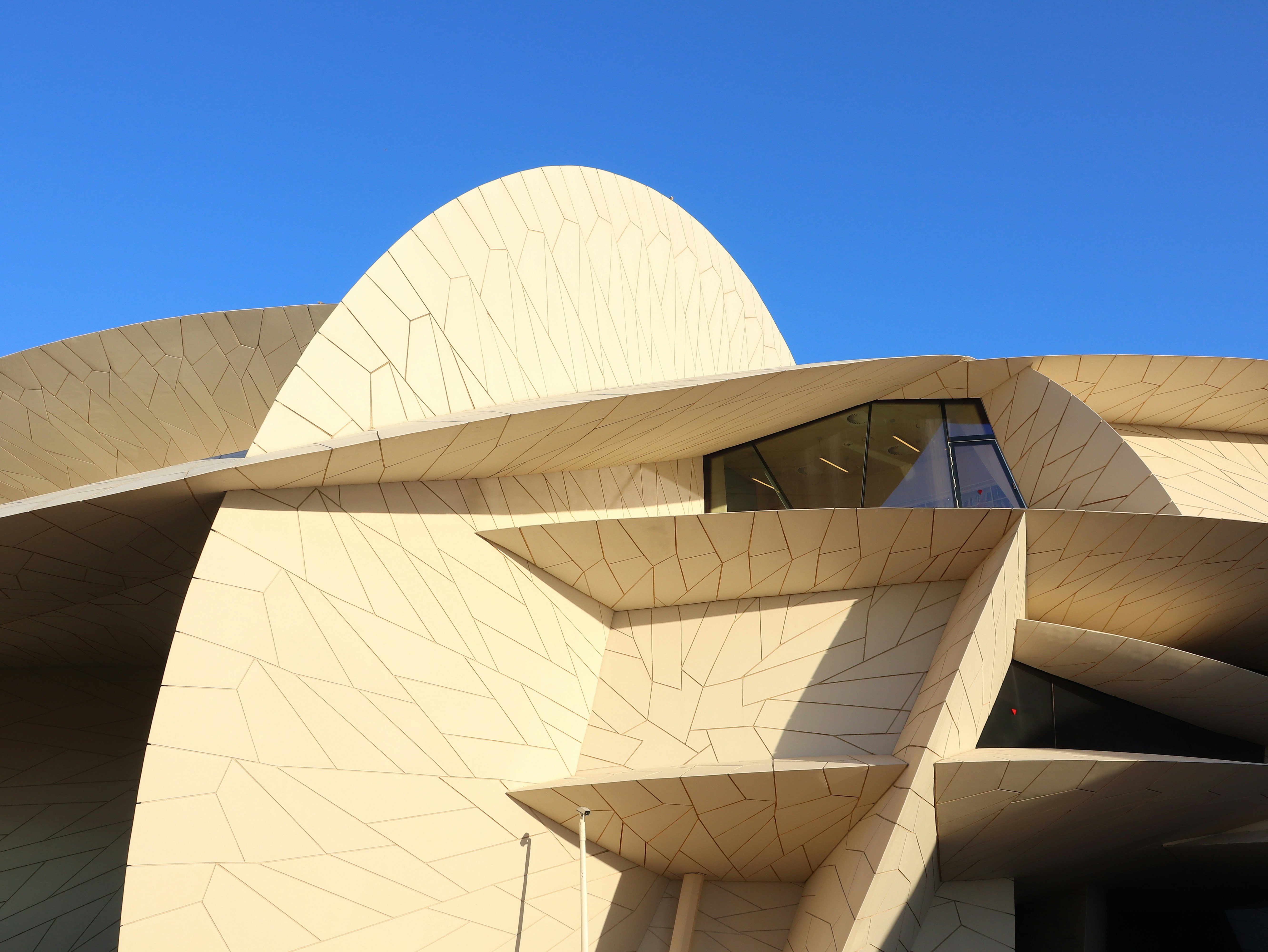 Radian Dome Over Angular Facades: Concrete Geometry in Daylight